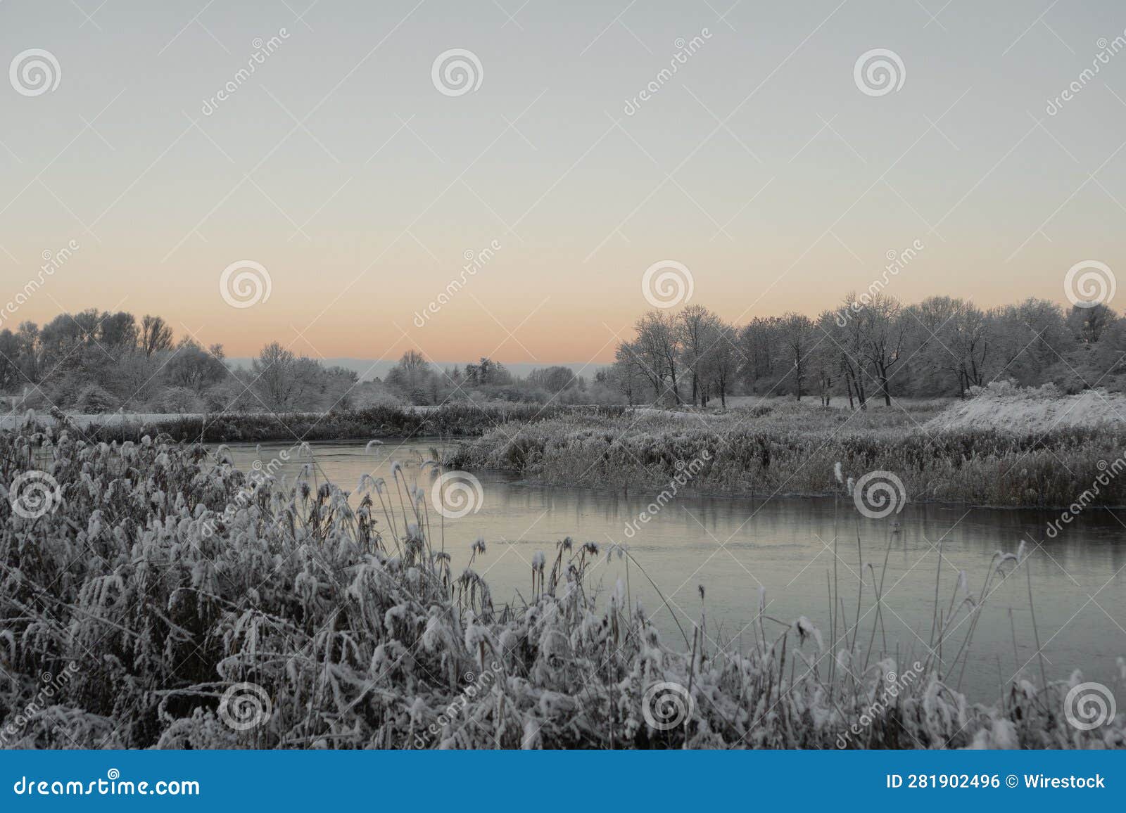 Idyllic Winter Scene of a Tranquil River Covered in a Layer of Ice ...