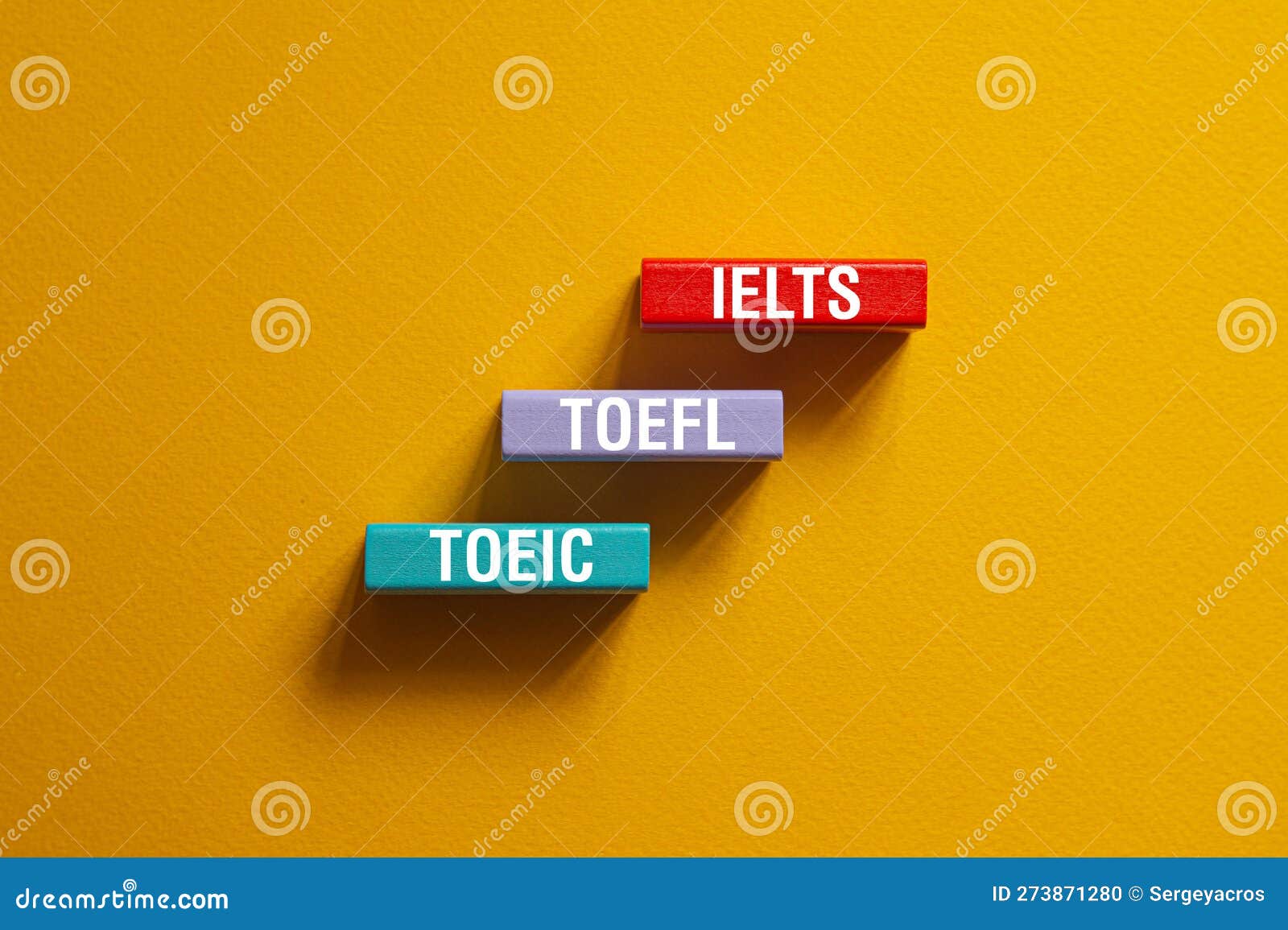 IELTS, TOEFL, TOEIC Word On Wooden Blocks On Blue Background Stock ...
