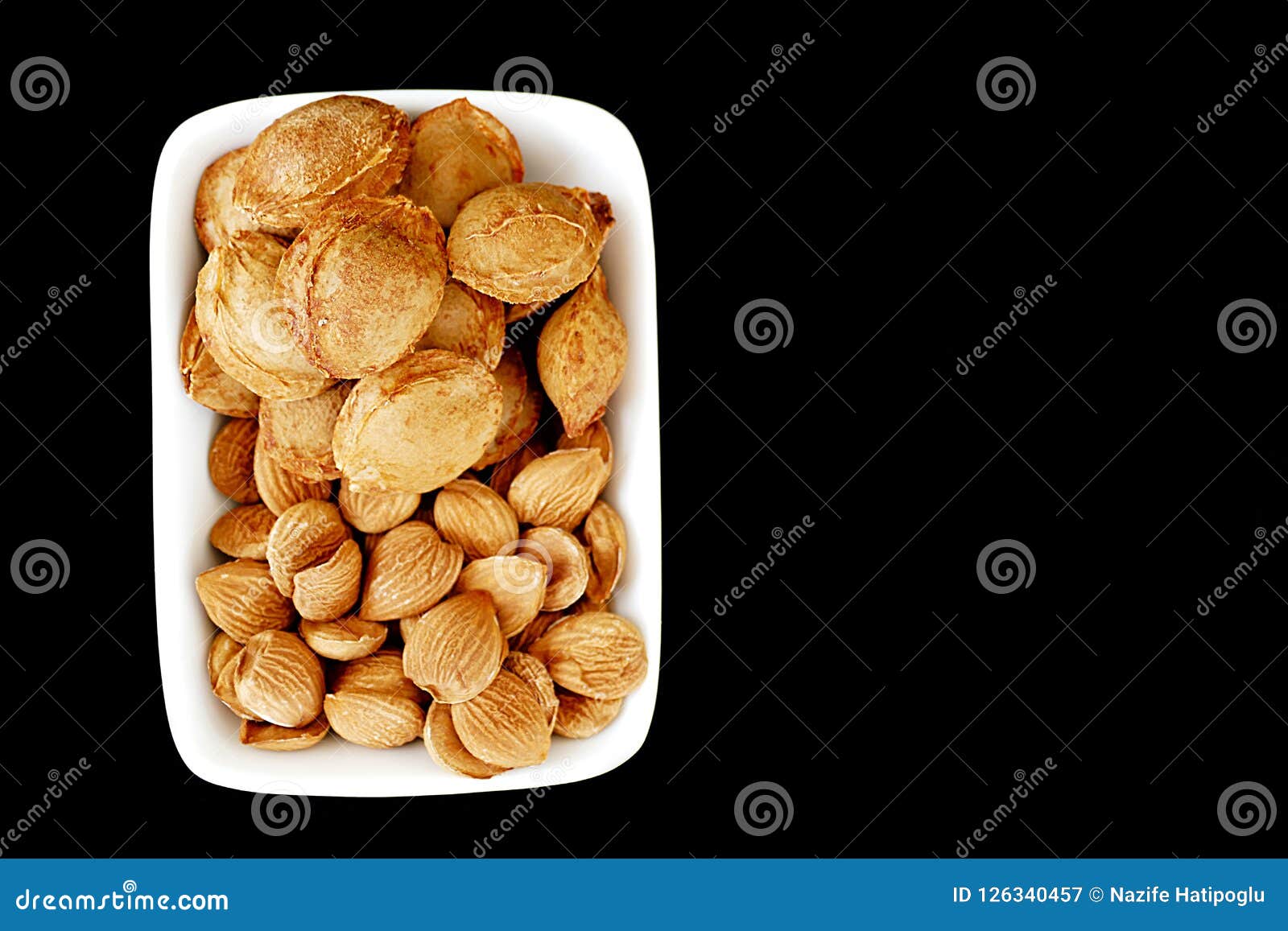 Eat Apricot Kernels in Plates, on Black Ground, Sweet Apricot Seeds ...
