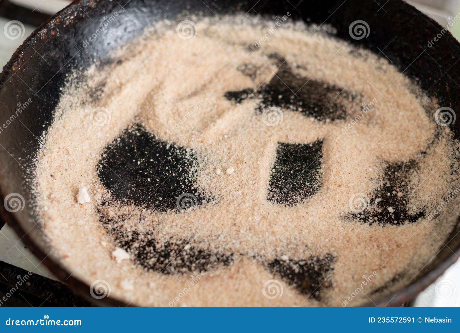 Ignite a Cast Iron Skillet with Salt on the Stove. Preparing the Pan ...