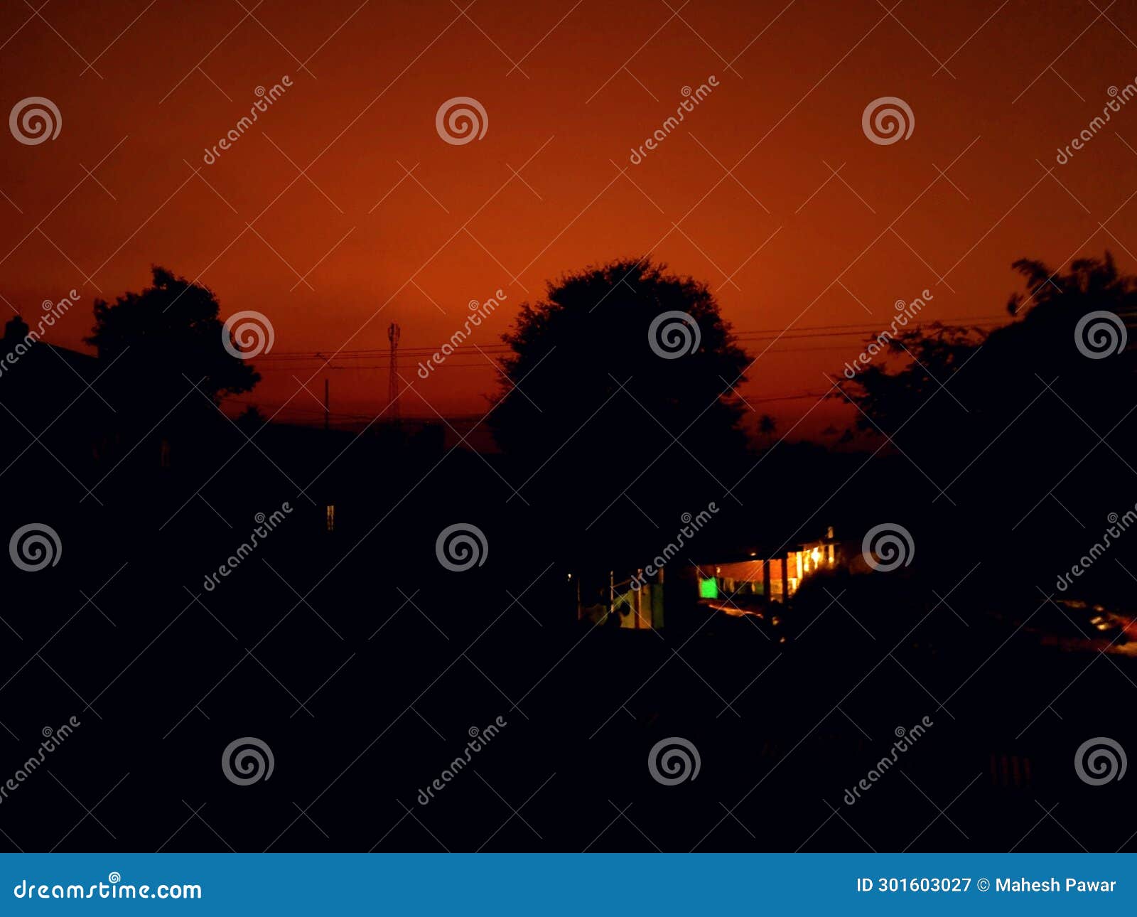 Ignited Light in Farmhouse Rooftop in the Dark at Orange Sky Sunset ...