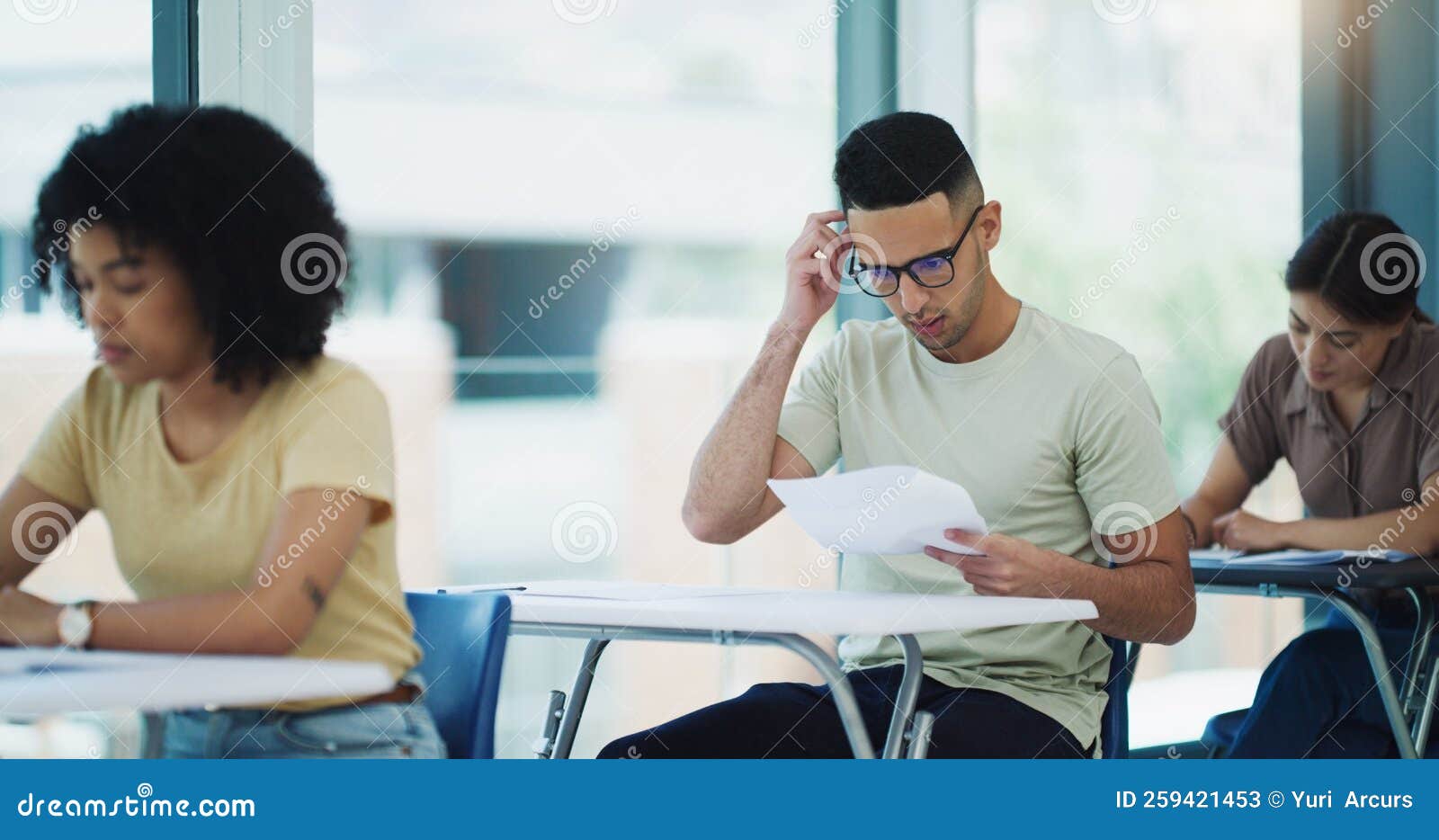 Ignorance is Just an Absence of Effort. Focused Students Completing an Exam at University. Stock ...