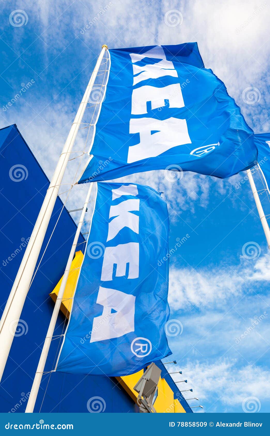 IKEA Flags Waving on Wind Against a Blue Sky Near the IKEA Samar ... IKEA Flags Waving on Wind Against a Blue Sky Near the IKEA Samar ...