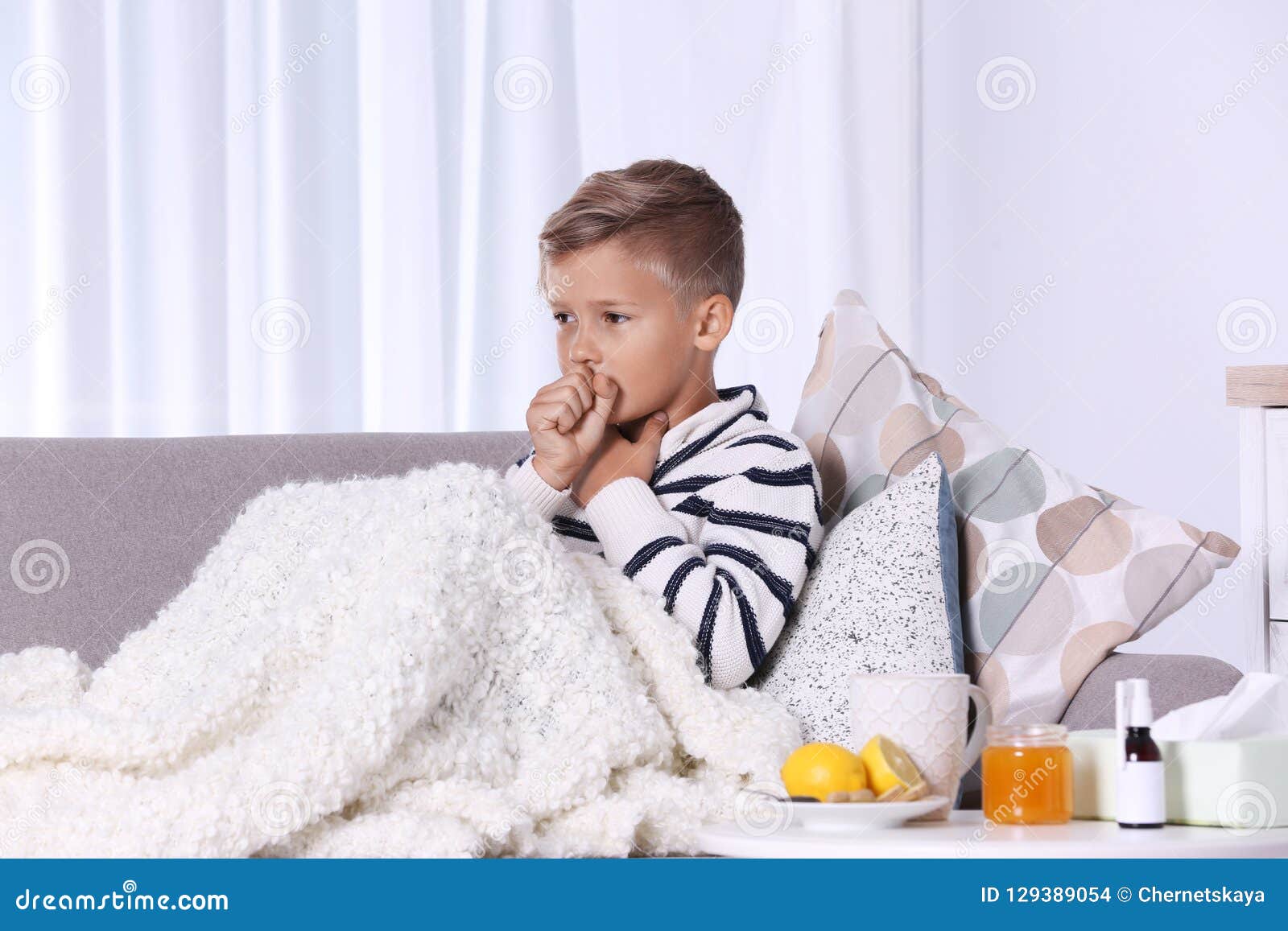 Ill Boy Suffering from Cough on Sofa Stock Photo - Image of sick ...