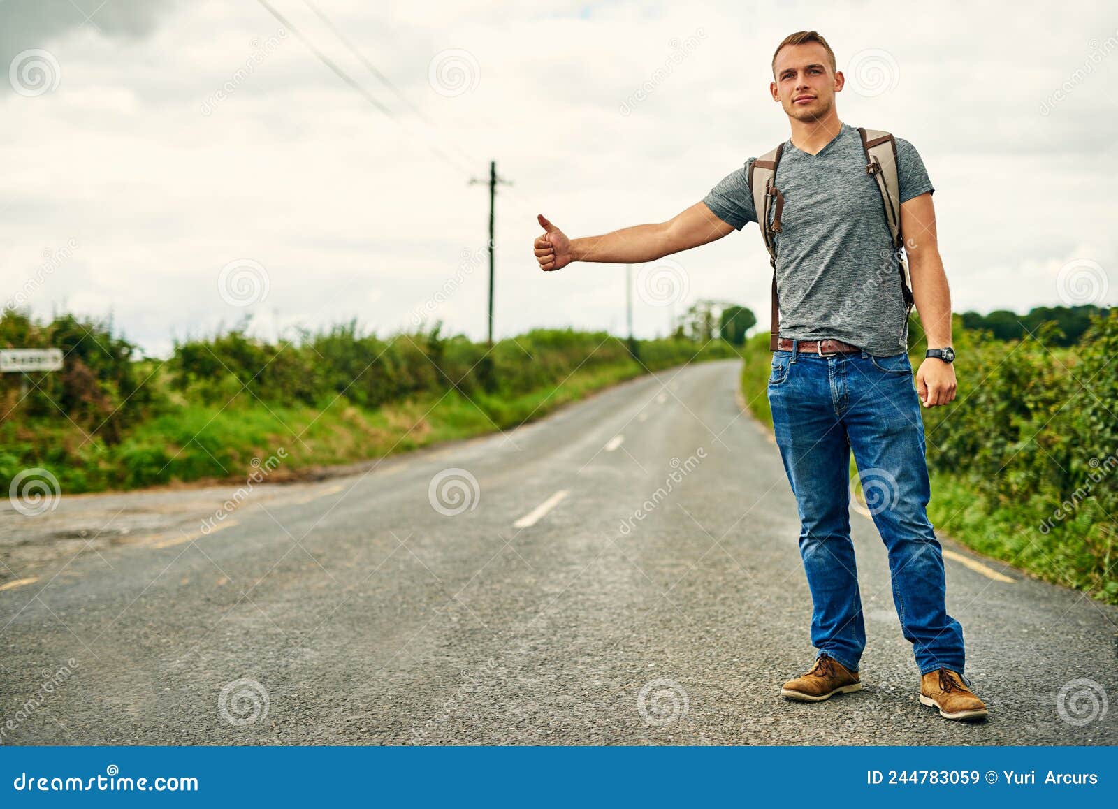 Ill Get Where I Need To Be Eventually Shot Of A Young Man Hitchhiking