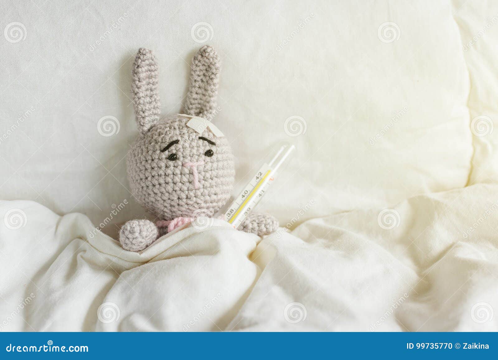 Ill Grey Toy Rabbit with Thermometer and Plaster on Head in White ...