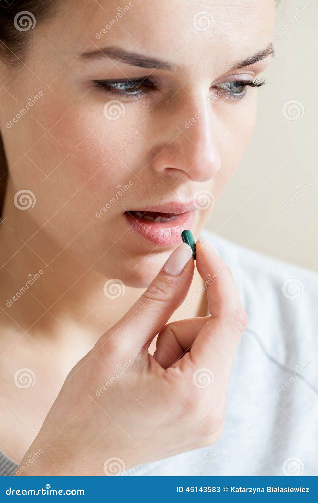 Ill woman taking a pill stock image. Image of ailing - 45143583