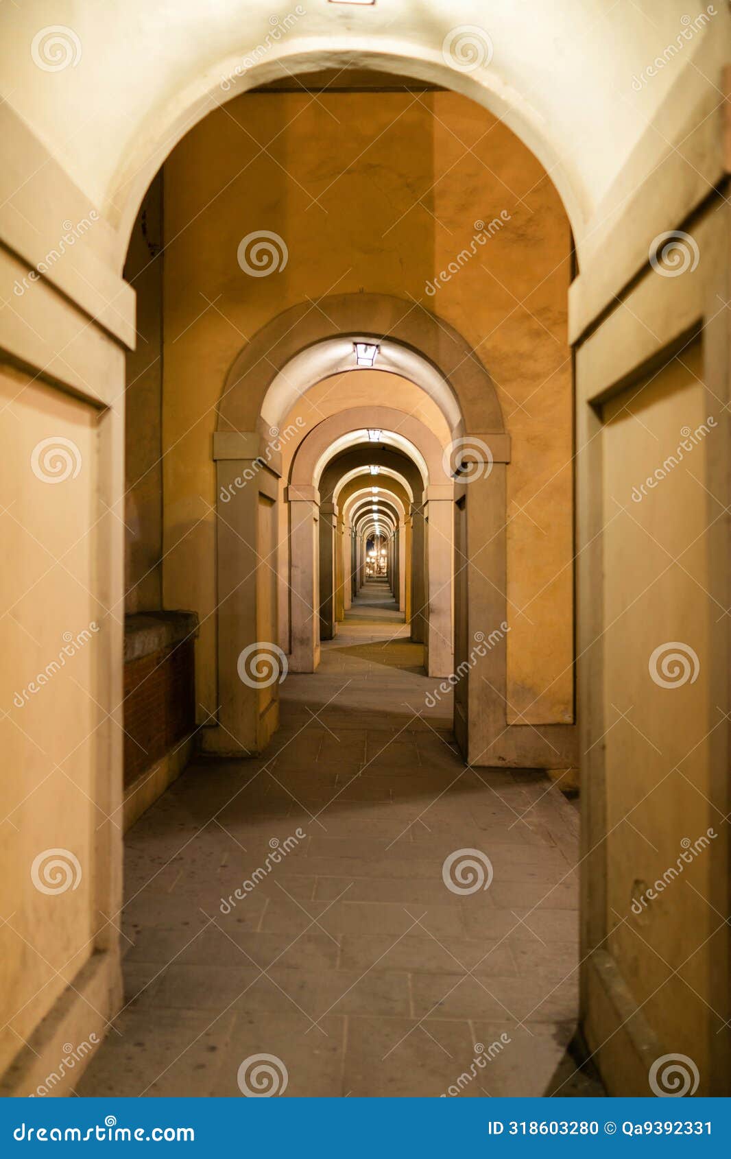 Illuminated Archway Corridor at Night Stock Photo - Image of structure ...