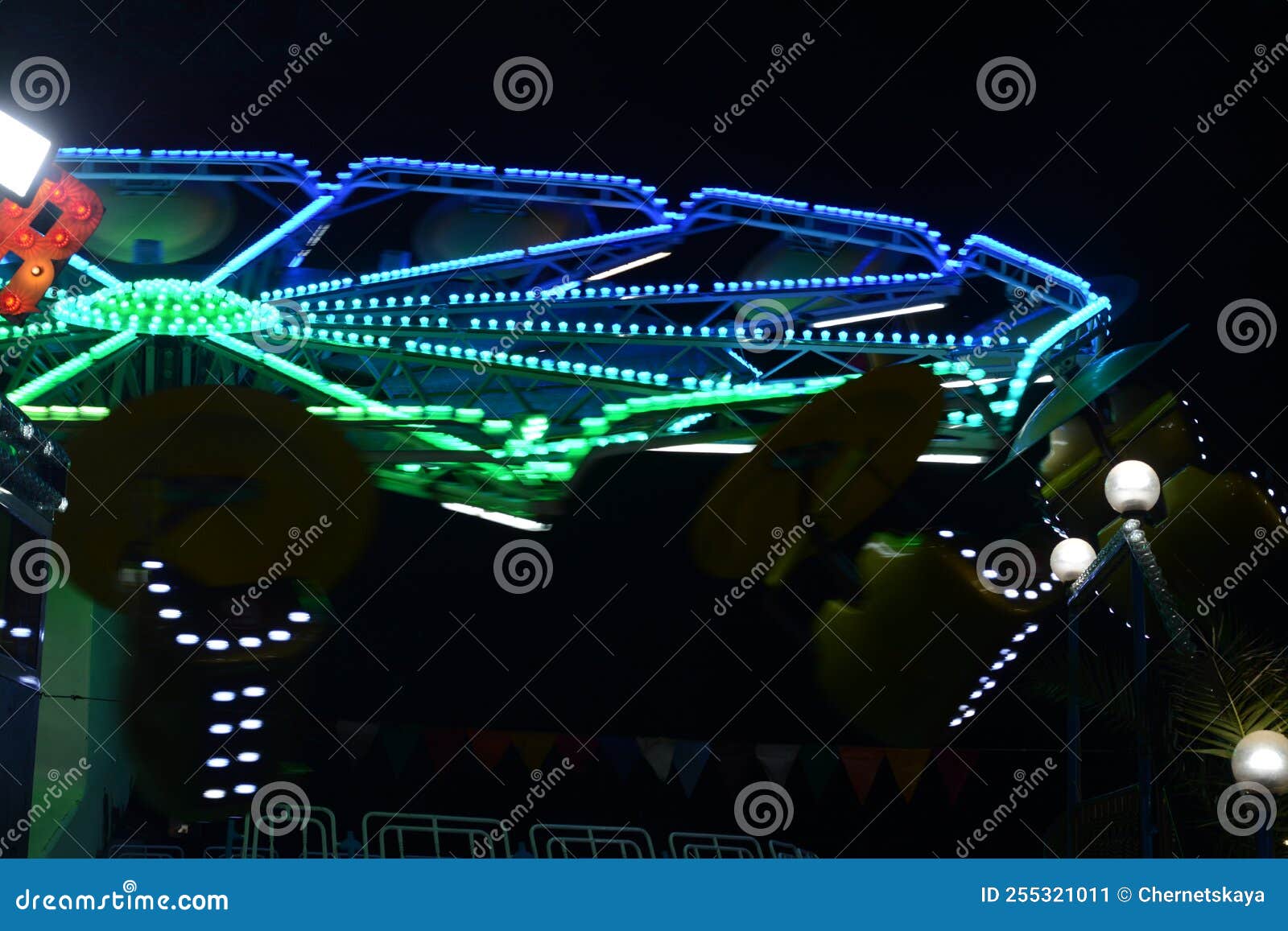 Illuminated Attraction in Amusement Park at Night Stock Image - Image ...