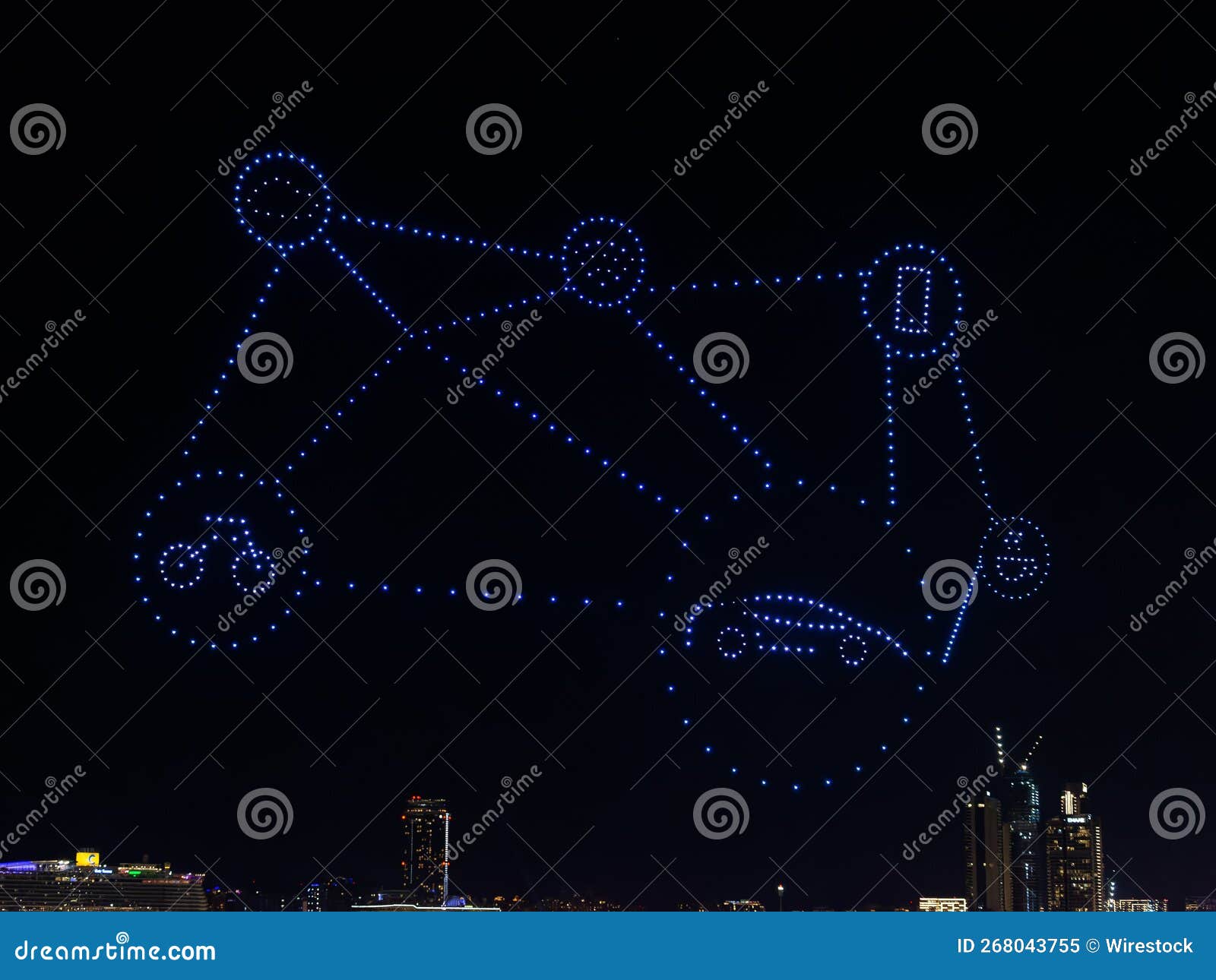 Illuminated Blue Drones Glowing in the Black Night Sky and Forming ...