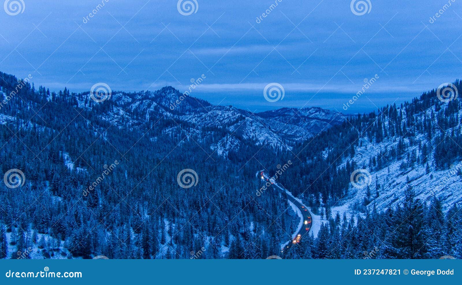 Illuminated Cabins and the Snow Covered Cascade Mountains in Washington ...