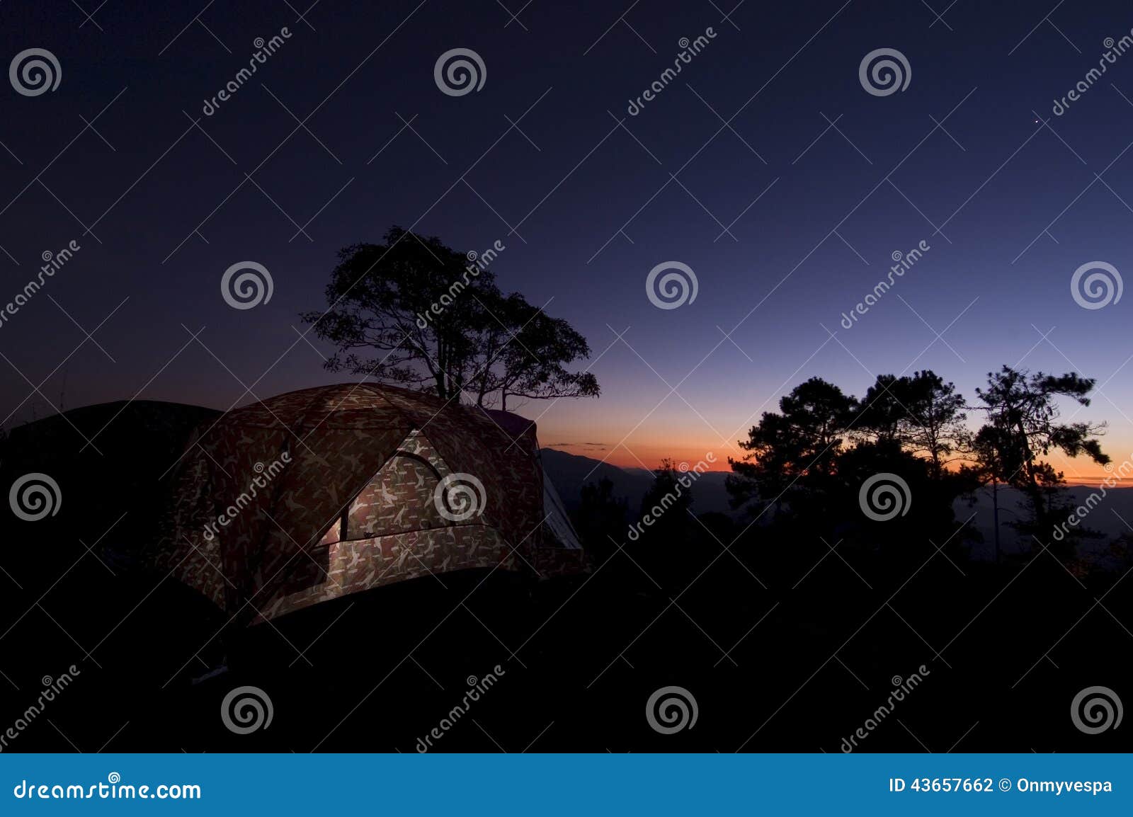 Illuminated Camping Tent At Twilight Under Sunset Sky On The Mountain ...