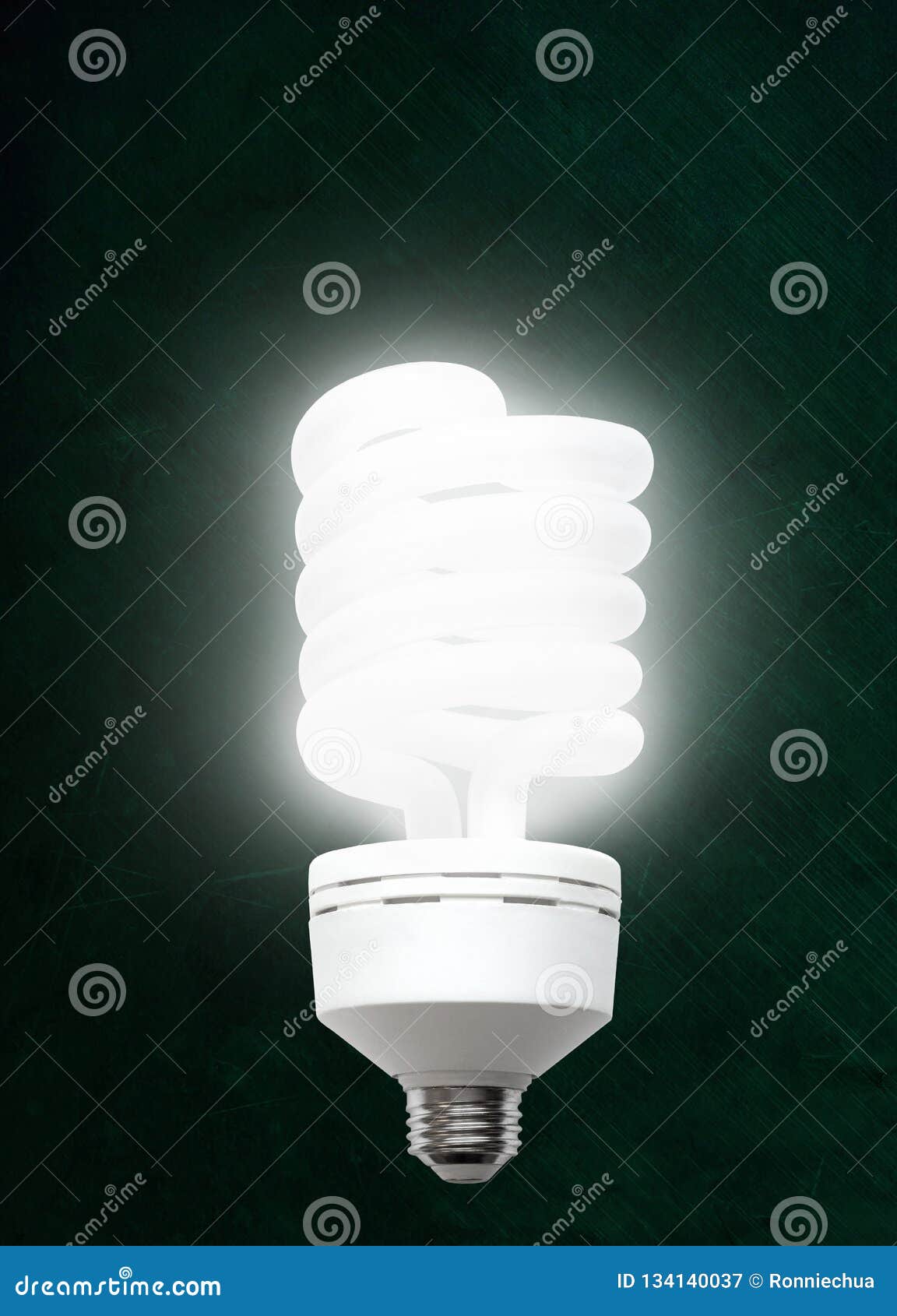 Illuminated CFL Compact Fluorescent Light Bulb on Chalkboard Background ...