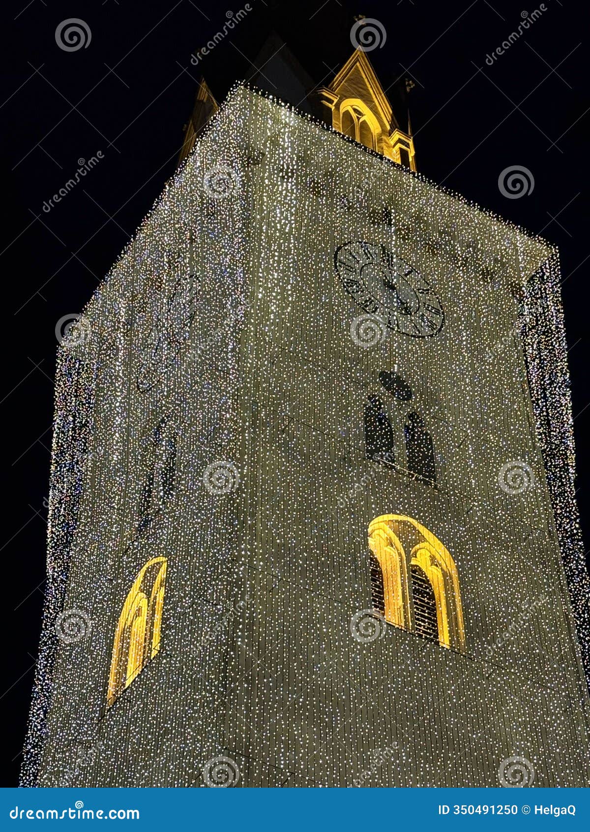 Illuminated Clock Tower at Night with Festive Lights Stock Illustration ...