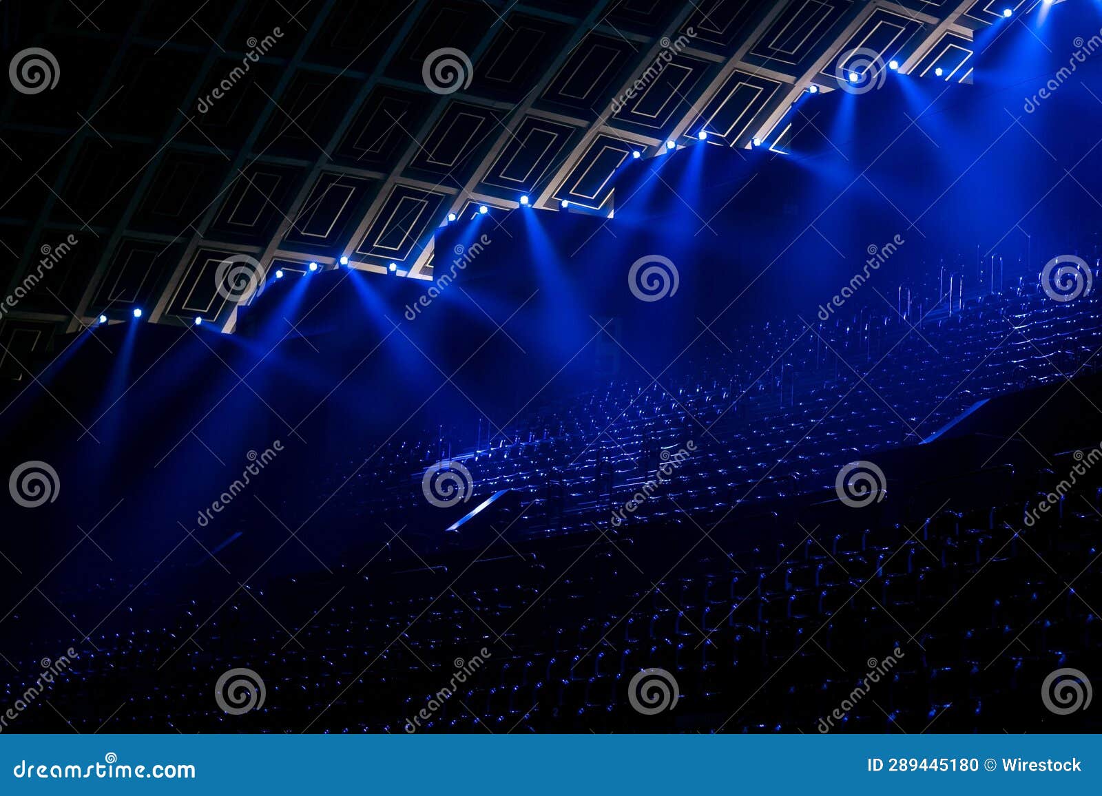 Illuminated Empty Blue Stadium with a Large Stage Stock Photo - Image ...