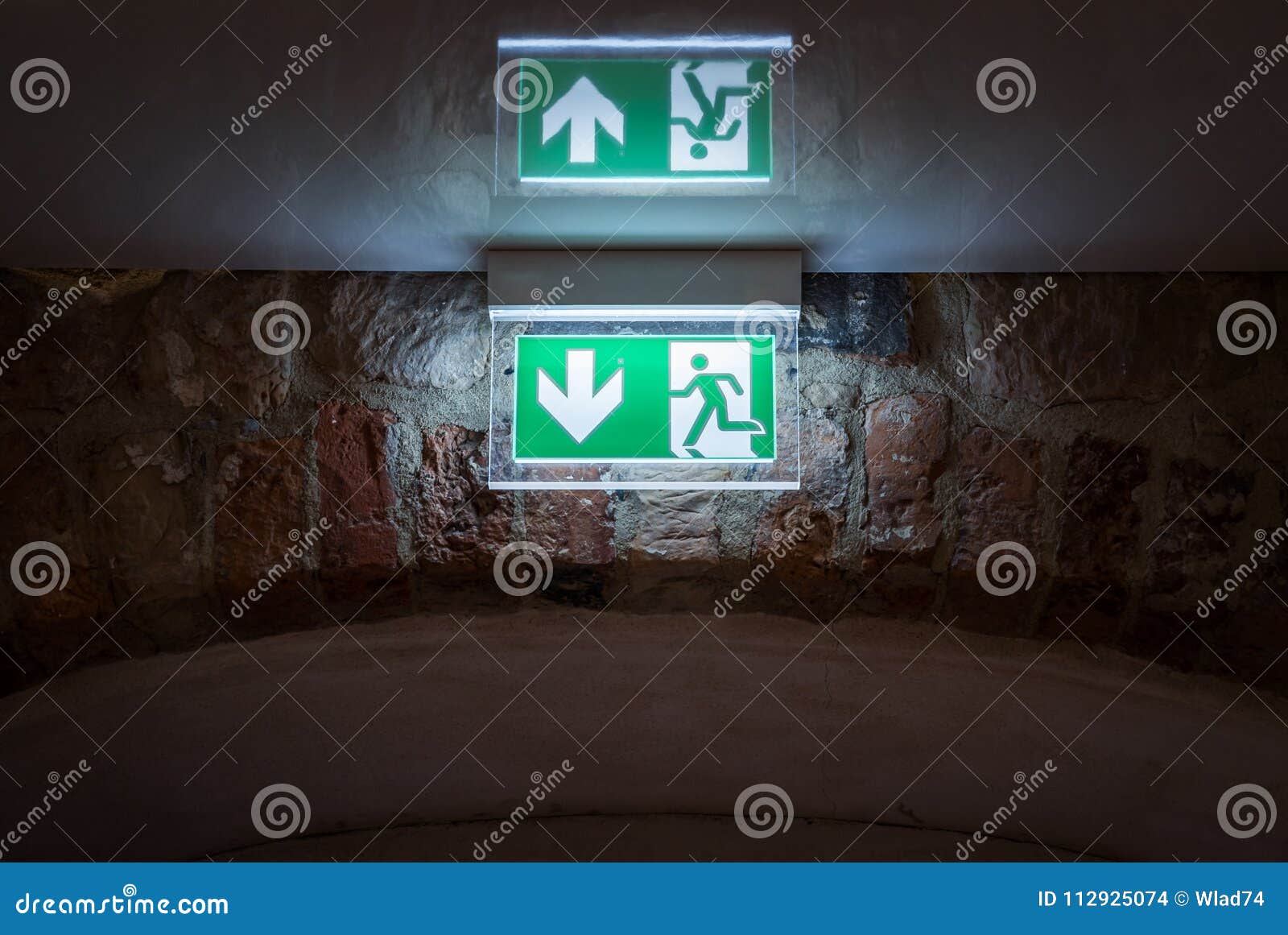 The Illuminated Green Exit Sign in Dark Room Stock Photo - Image of ...