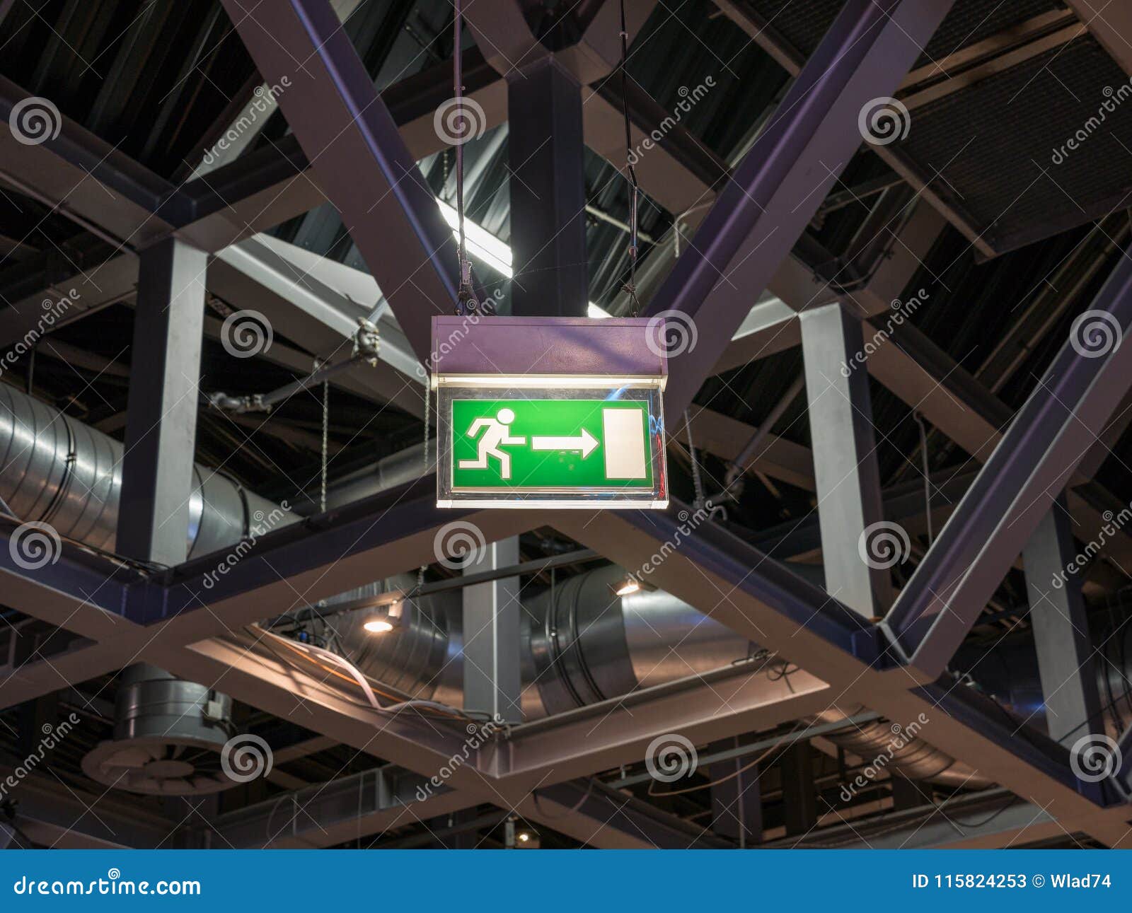 The Illuminated Green Exit Sign in Dark Room Stock Image - Image of ...