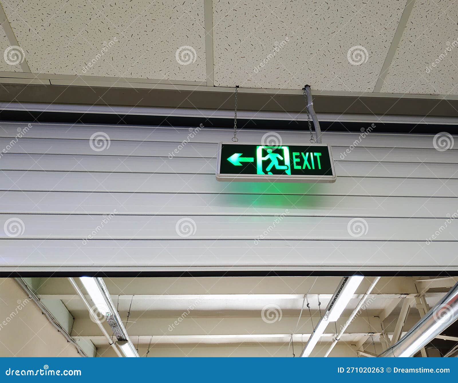 Illuminated Green Exit Sign or Fire Escape Sign. Stock Image - Image of ...
