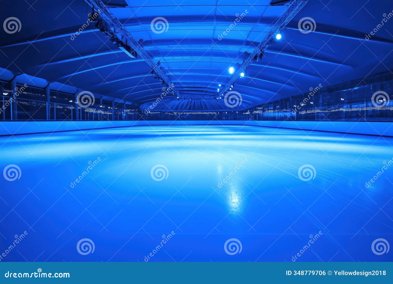 Illuminated Indoor Ice Rink with Modern Blue Lighting and Empty Smooth ...