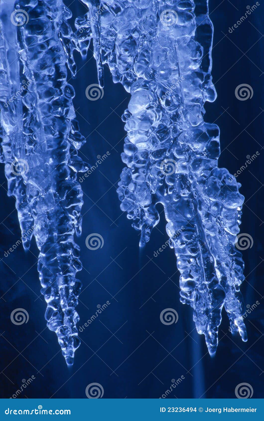 Illuminated Large Icicles Hanging by Waterfall Stock Photo - Image of ...