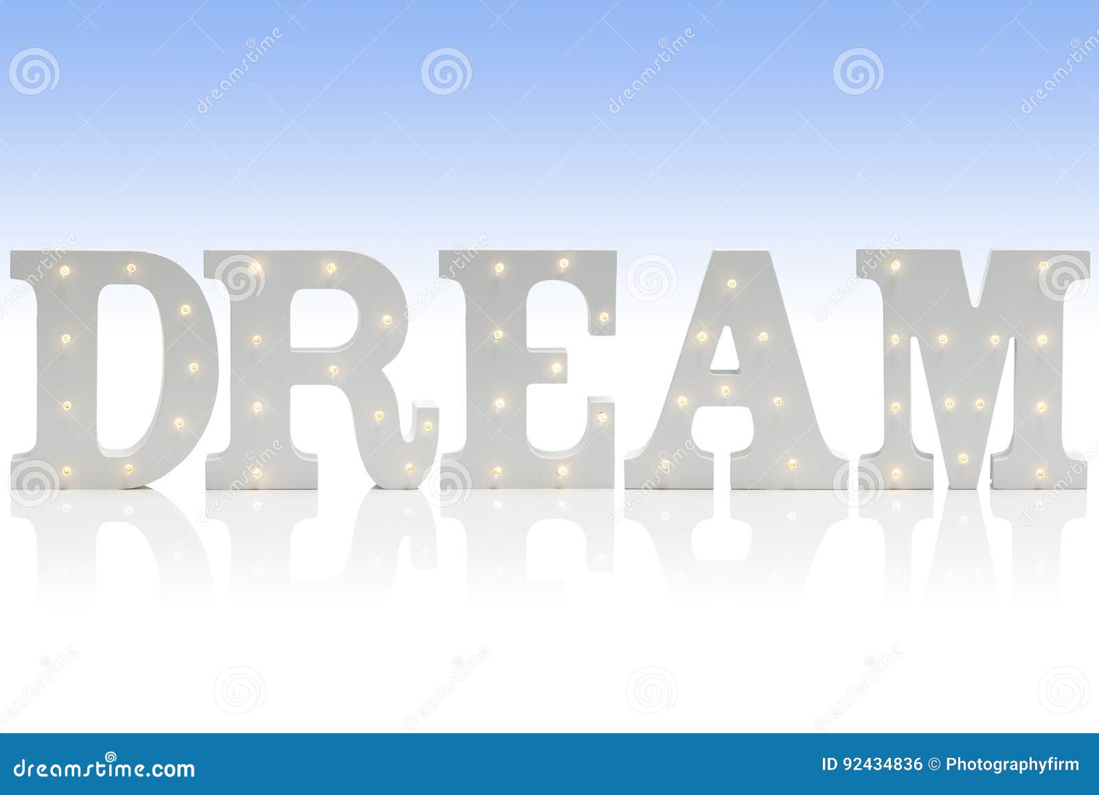 Illuminated Letters Spelling DREAM Over Blue-White Gradient Back Stock ...