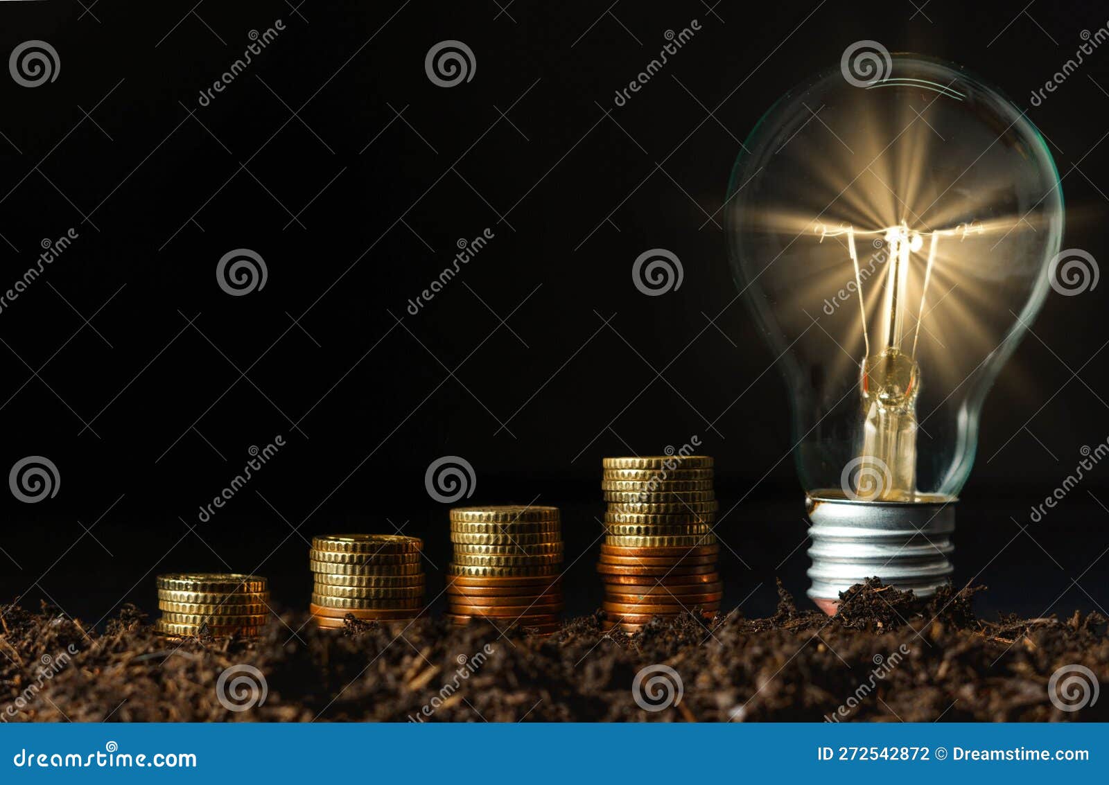 Illuminated Light Bulb with Coins Stack Stock Photo - Image of ecology ...