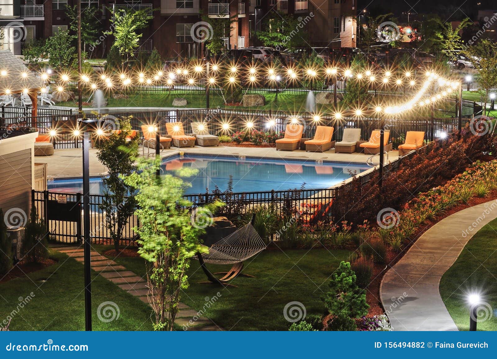 Illuminated Open Swimming Pool in an Apartment Complex Stock Photo ...