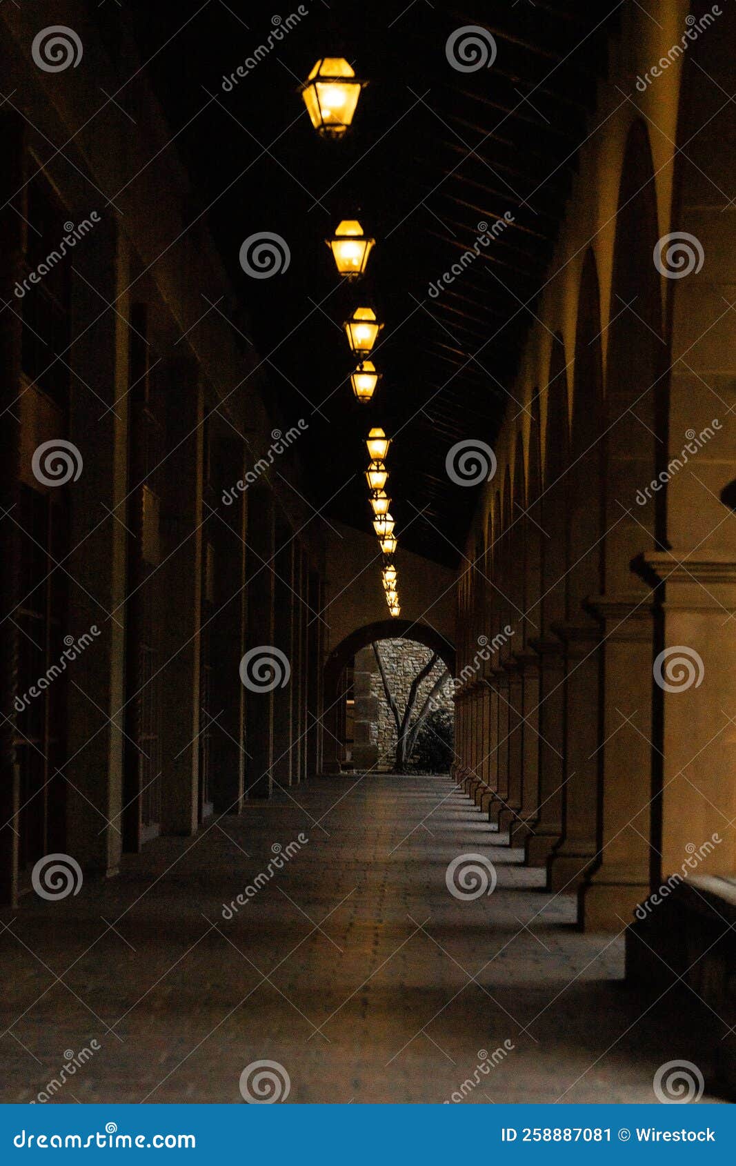 Illuminated Pathway Under the Building Stock Image - Image of facade ...