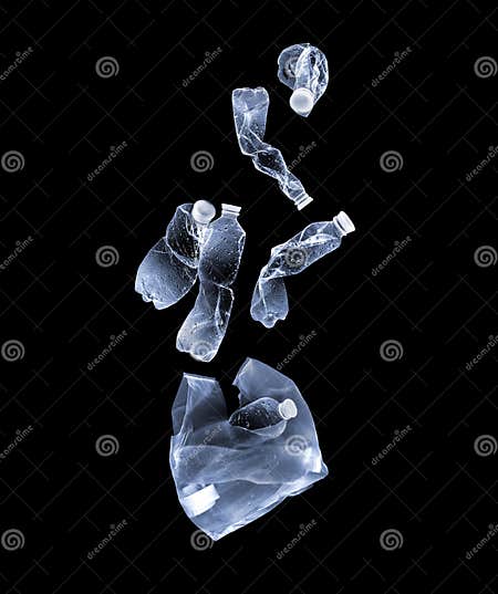 Illuminated Plastic Bag with Plastic Bottles in the Dark Stock Image ...