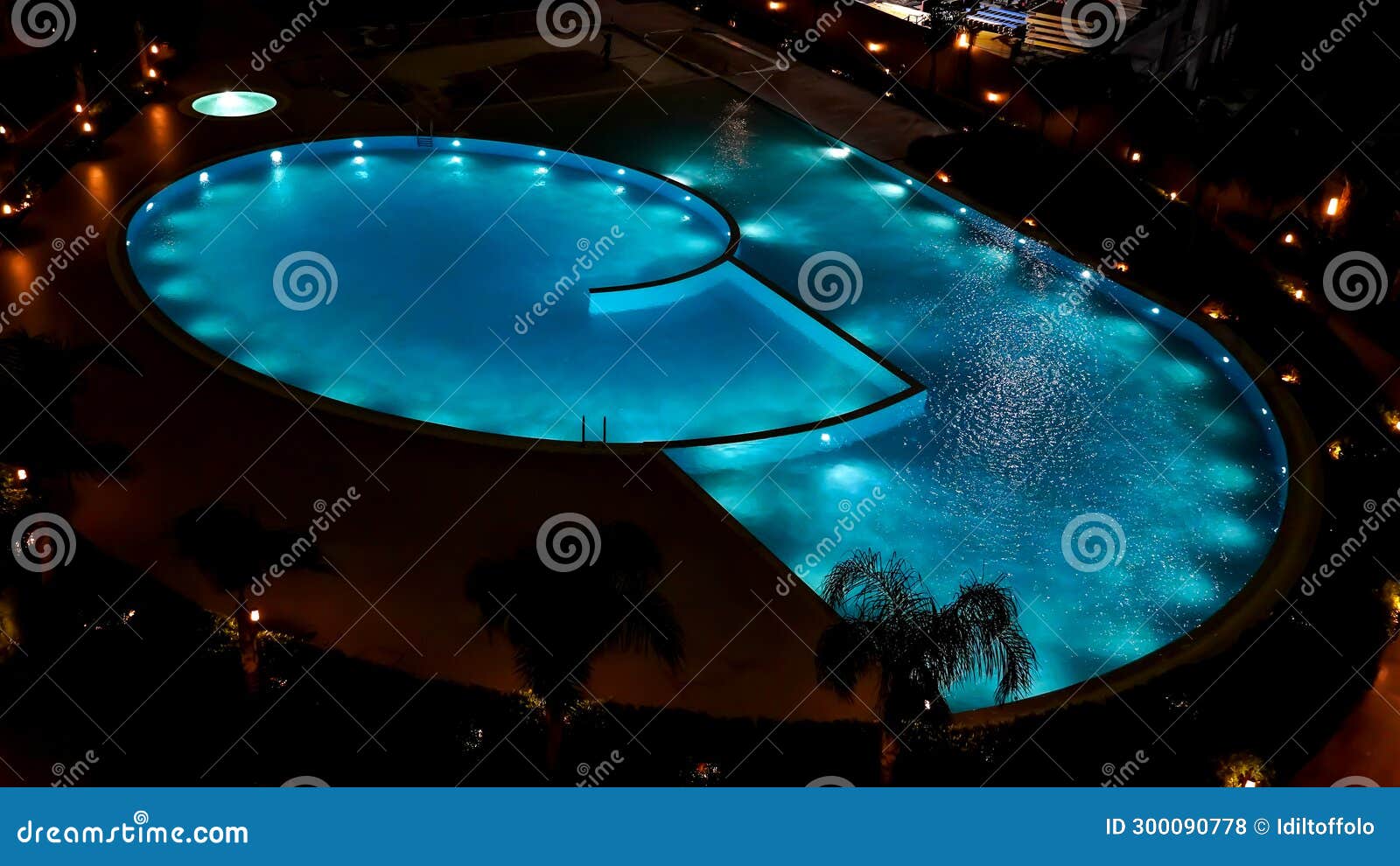 An Illuminated Pool with Modern Architecture and Night Lights Stock ...