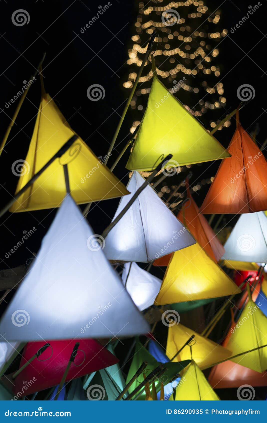Illuminated Pyramid-Shaped Paper Lanterns with Christmas Tree in Stock ...