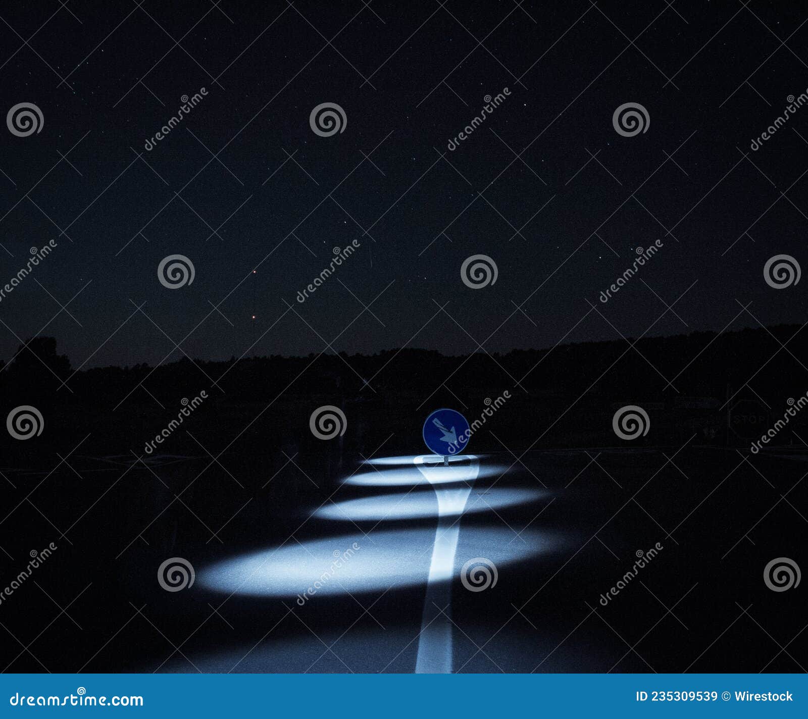 Illuminated Road with a Sign on it Under a Starry Sky at Night Stock ...