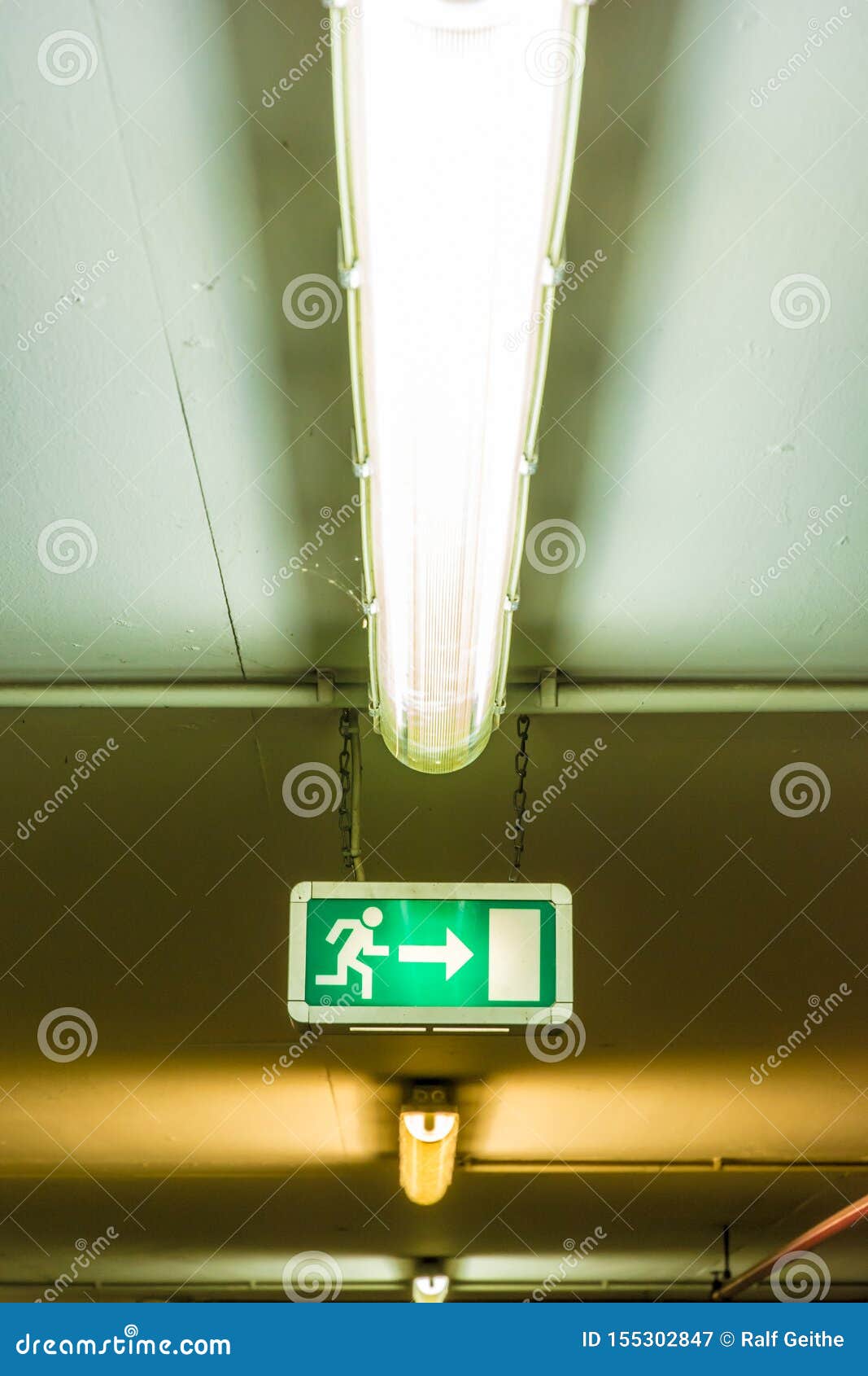 Illuminated Sign on the Ceiling Shows the Emergency Exit Stock Image ...
