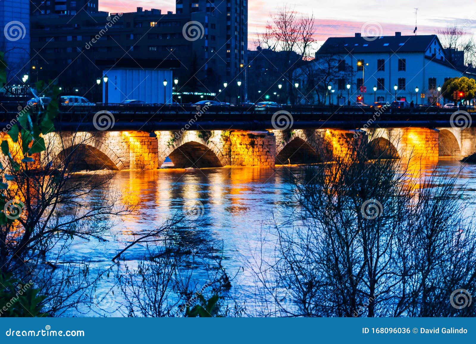 Illuminated Stone Bridge Over the River at Night Stock Photo - Image of ...