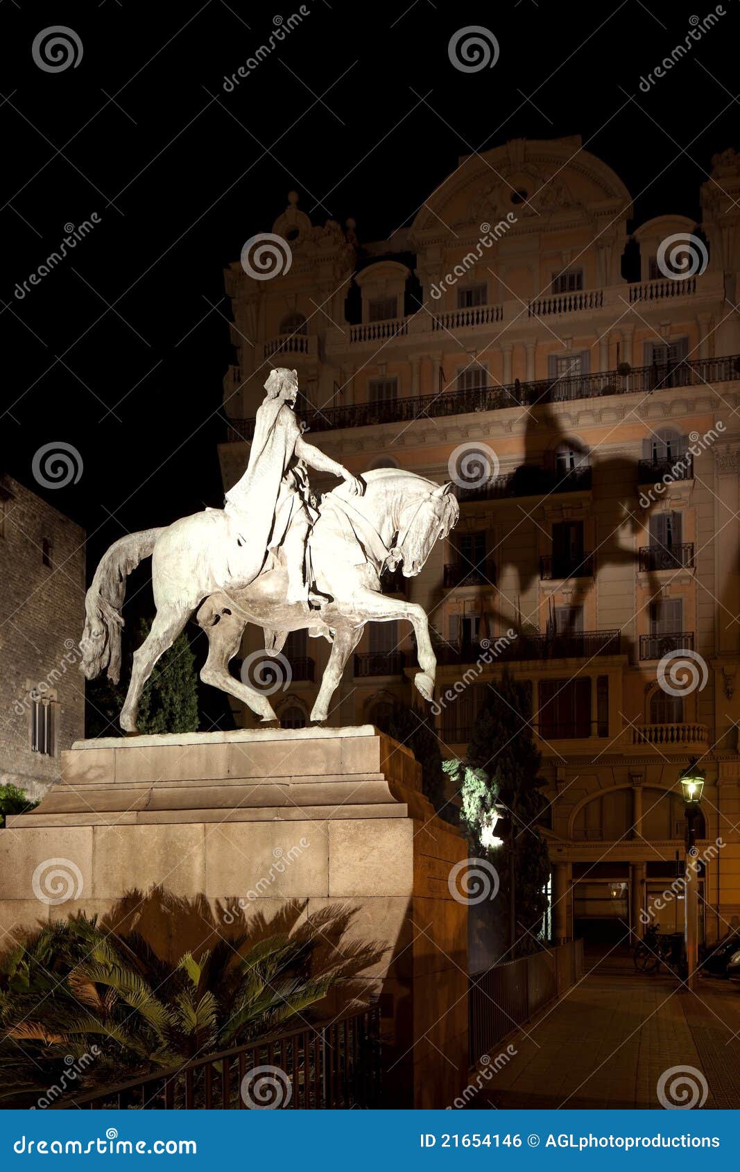 Illuminated Stone Statue at Night Stock Photo - Image of mounted ...