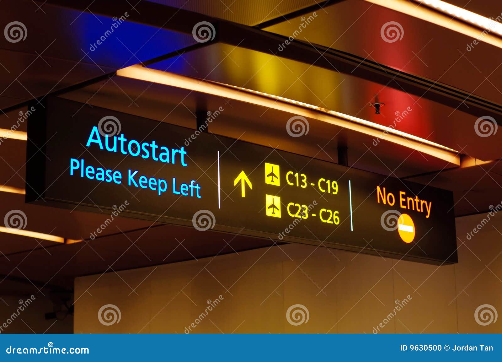 Illuminated Travelator And Directional Signs Stock Photography ...