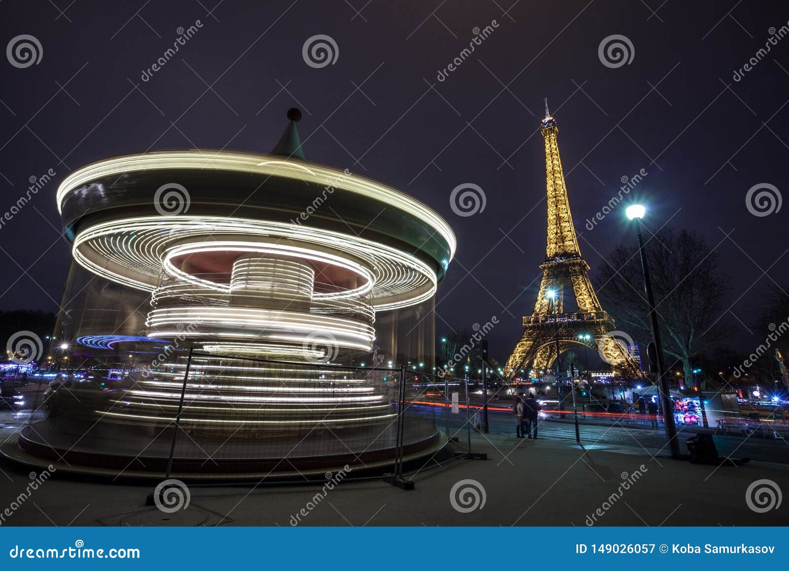 Illuminated Vintage Carousel and Eiffel Tower at Night, Paris Editorial ... Illuminated Vintage Carousel and Eiffel Tower at Night, Paris Editorial ...