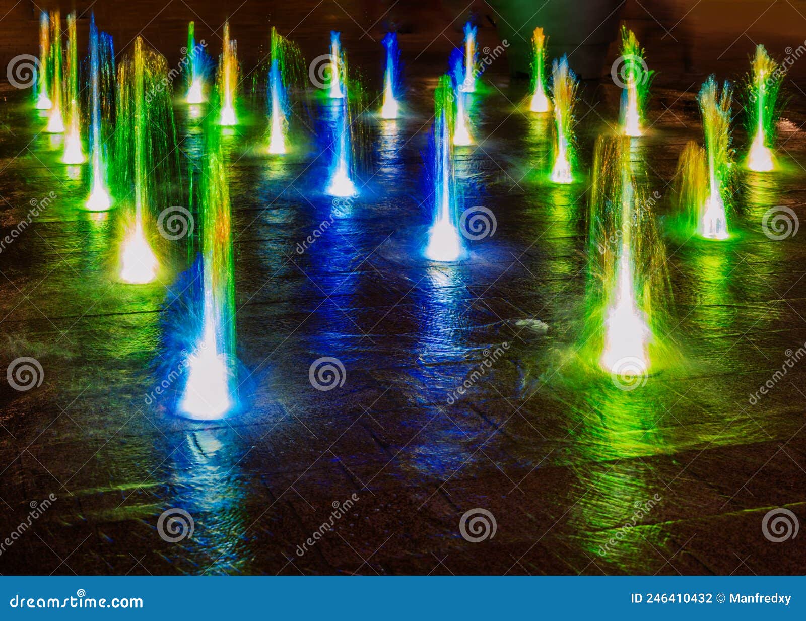 Illuminated Waterspout Fountain at Night Stock Photo - Image of ...