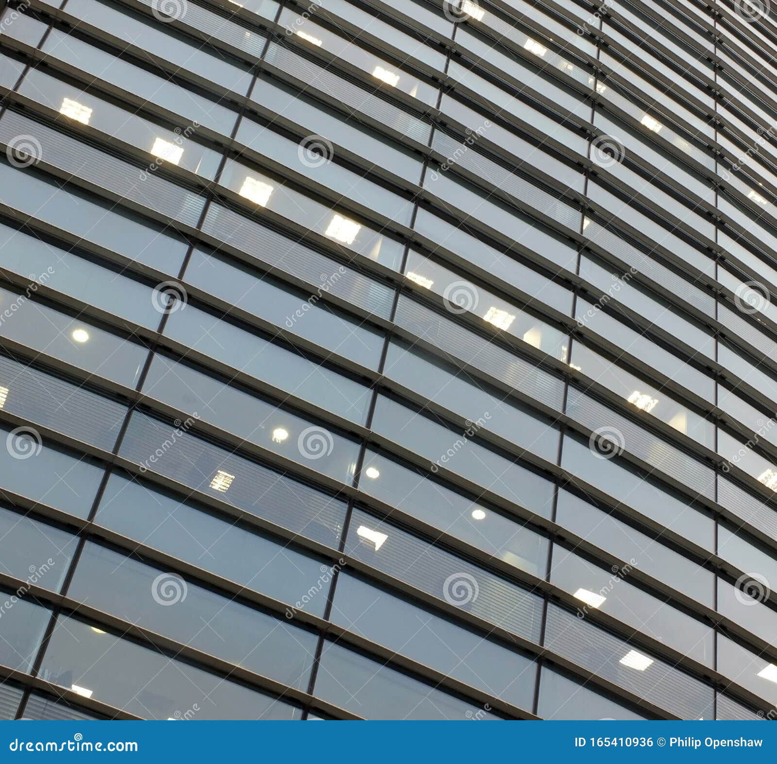 Illuminated Windows on the Facade of a Large Curved Modern Office ...
