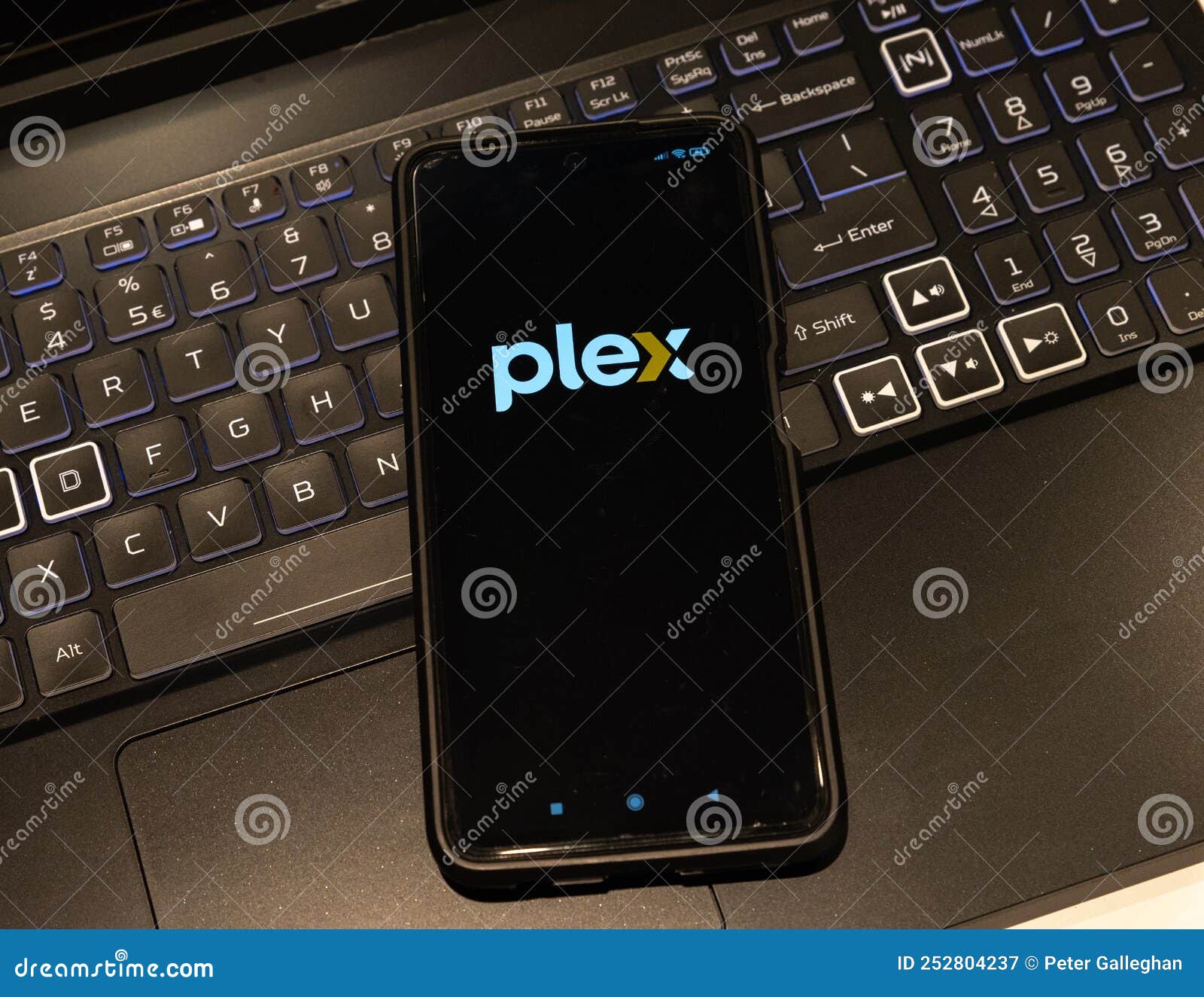 Illustration of the Plex Logo Displayed on a Smartphone Screen , Back ...