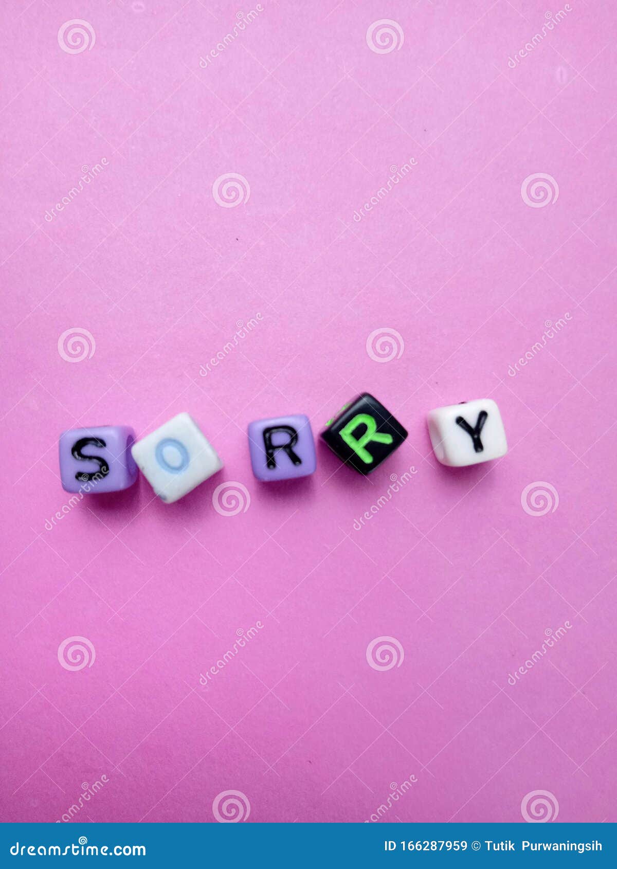 Photo Illustration, Word Sorry from Plastic Alphabet Cube Beads Stock ...