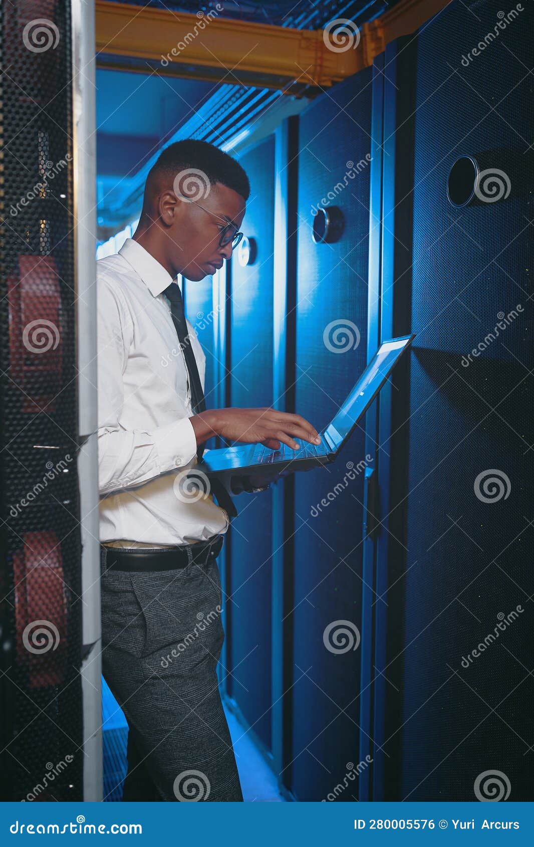 Im the Code Master of the Server Room. a Young it Specialist Standing ...