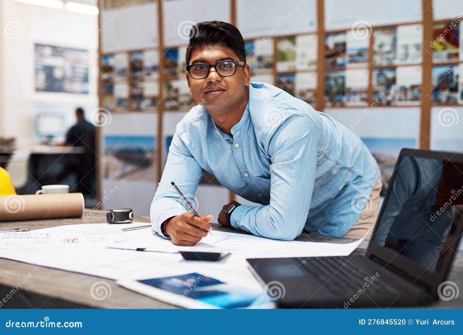 Im Committed To Completing this Project. a Young Architect Drawing Up a ...