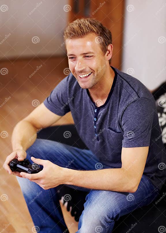 Im almost Past this Level. Handsome Guy Playing a Video Game Using a ...