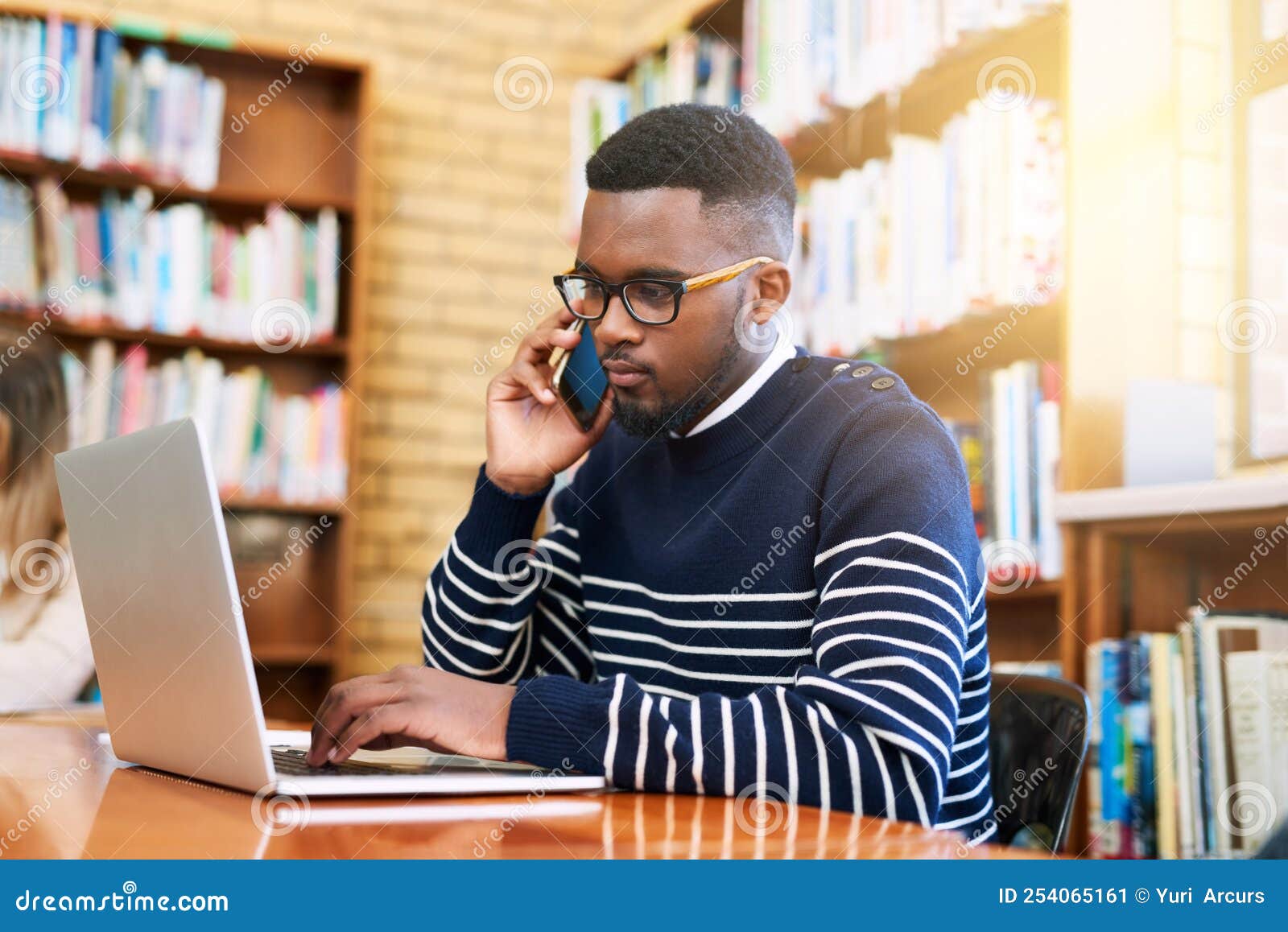 Im Studying in the Library. a University Student Doing Some Research on ...