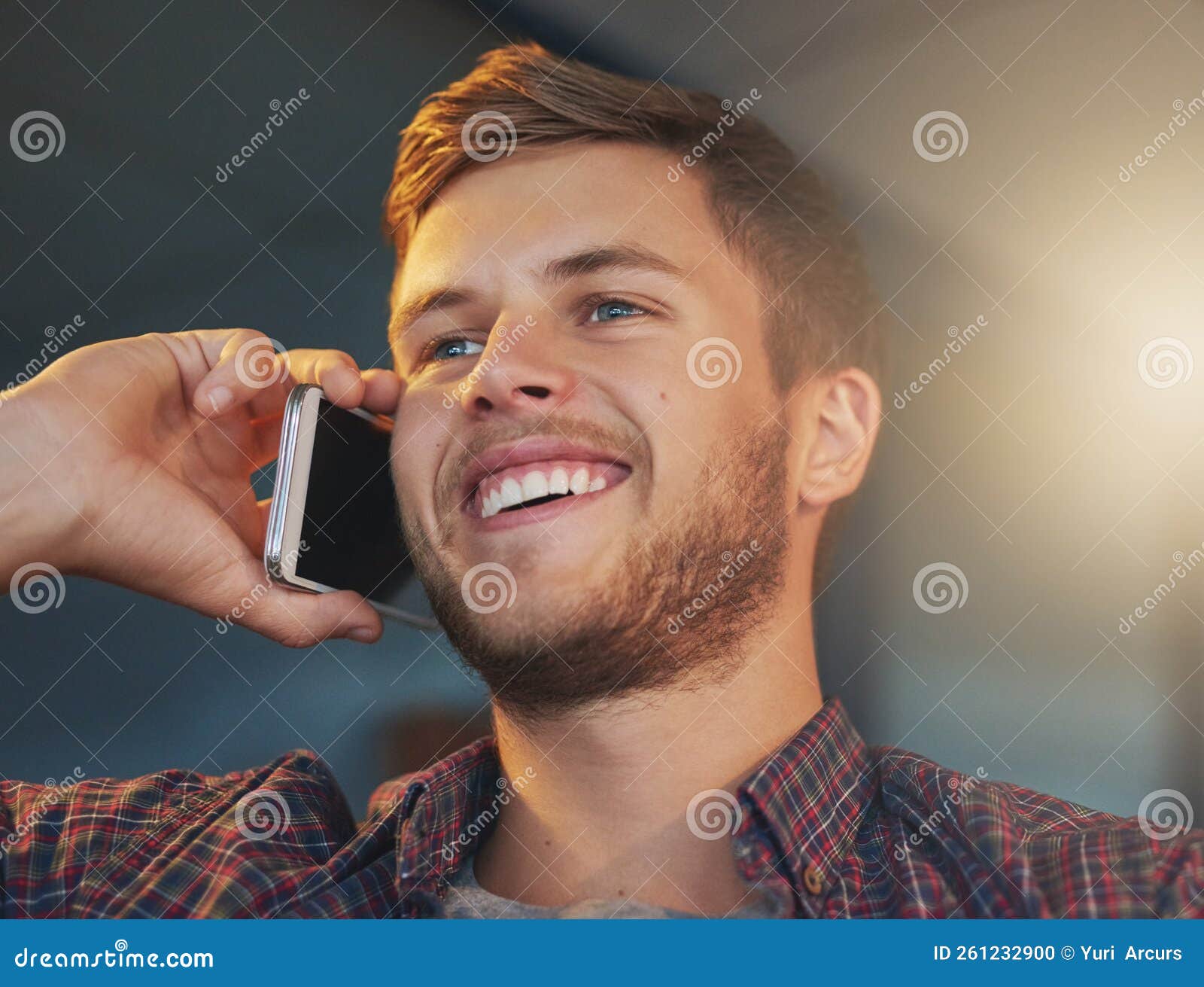 Im on it. a Young Man Using His Cellphone while Working Late in the ...