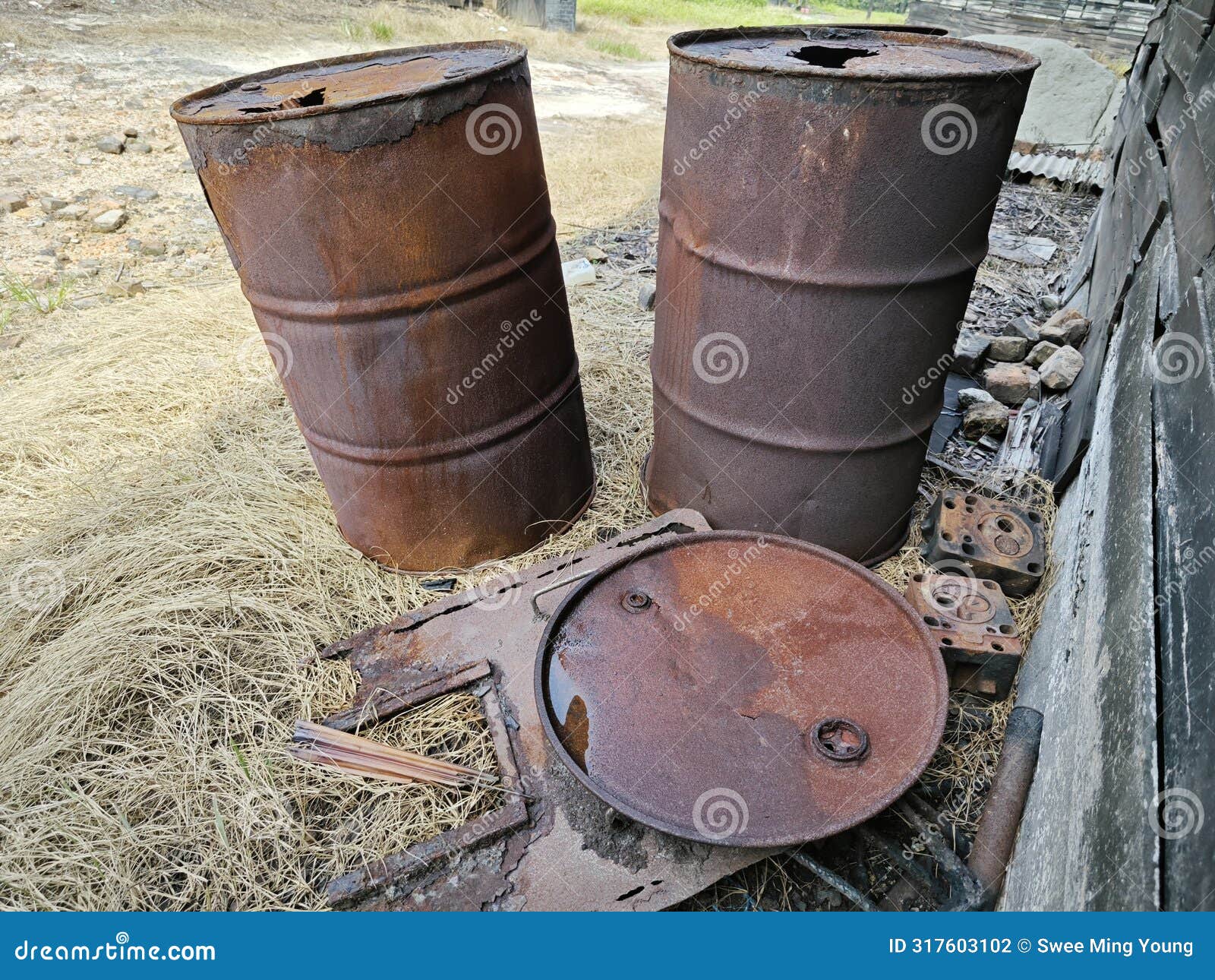 Abandoned Empty and Rusty Metal Barrel Left at the Junkyard. Stock ...