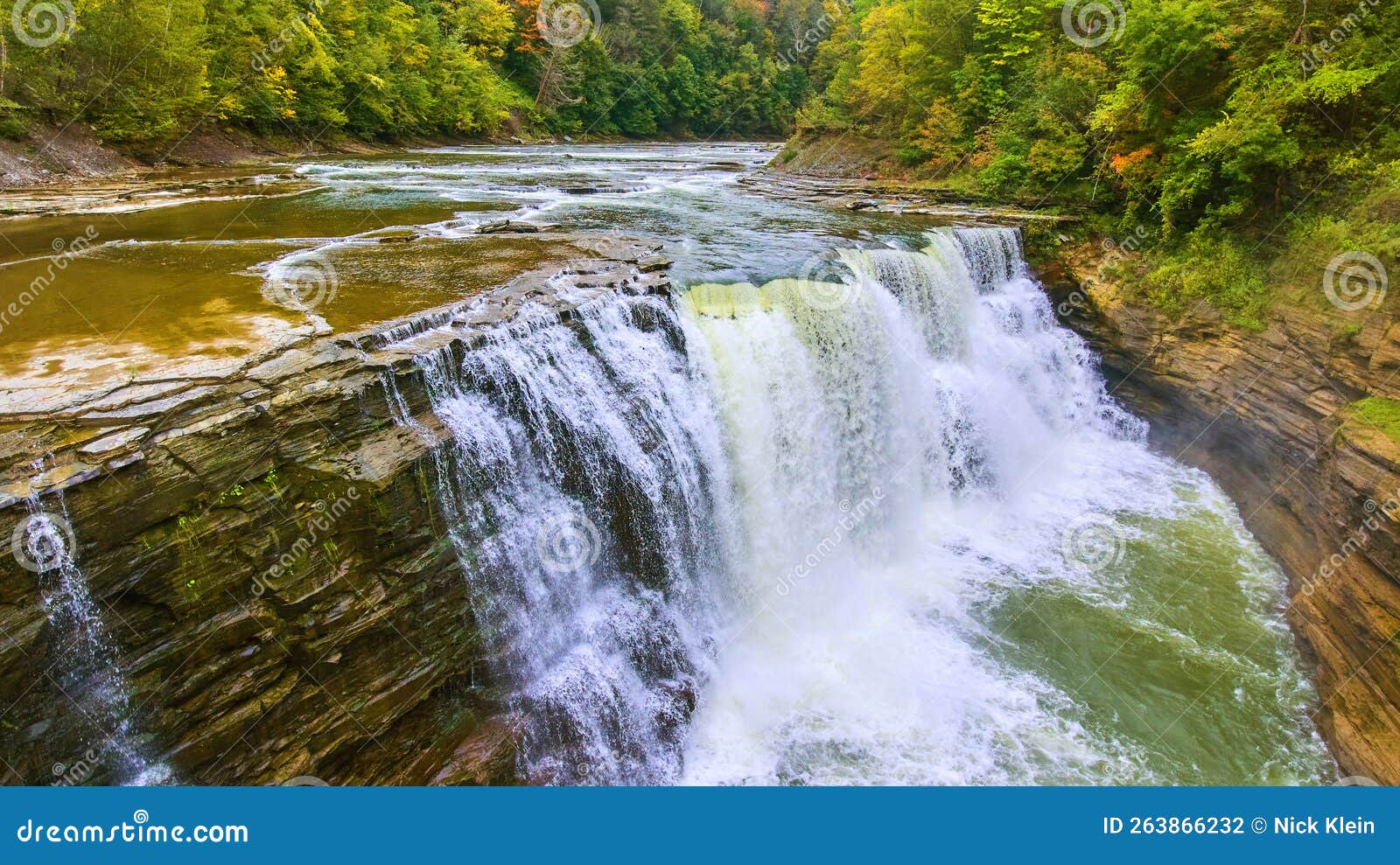 Aerial Along Edge of Huge Raging Waterfall Pouring Over Cliffs ...