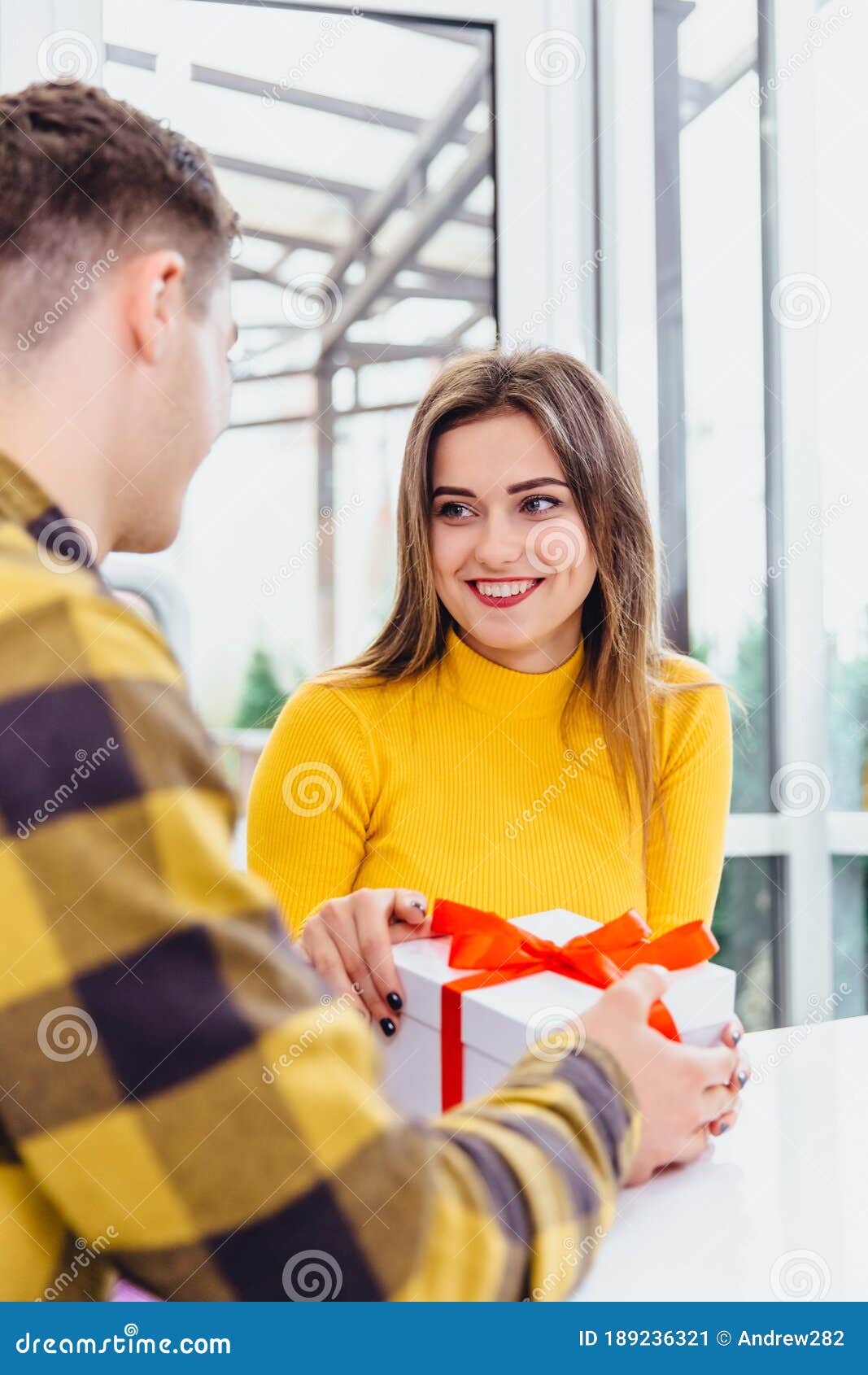 Image of Affectionate Boy Giving Her Girlfriend a Present when they ...