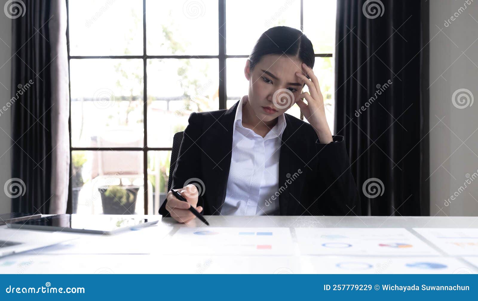 Image of an Asian Woman Who is Tired and Overthinking from Working with ...